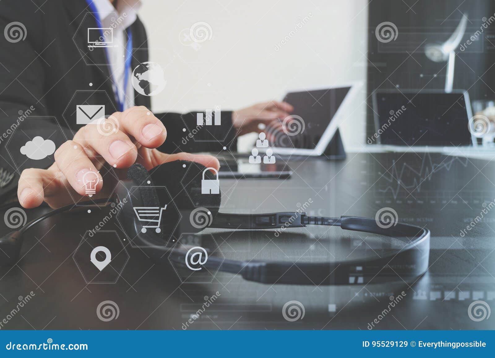 Man Using VOIP Headset with Digital Tablet and Laptop Computer a Stock ...