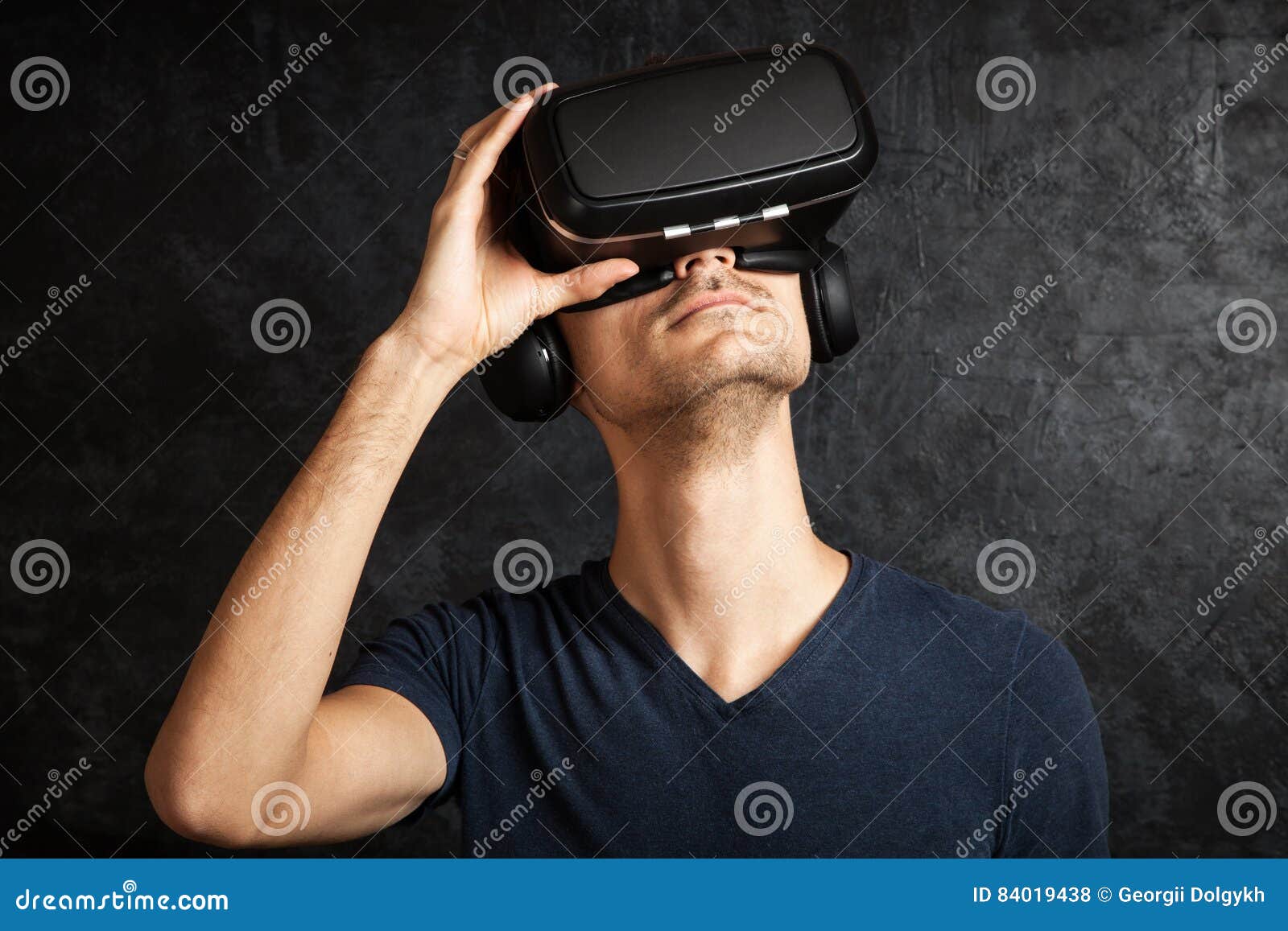 Man using VR goggles stock photo. Image of immersive - 84019438
