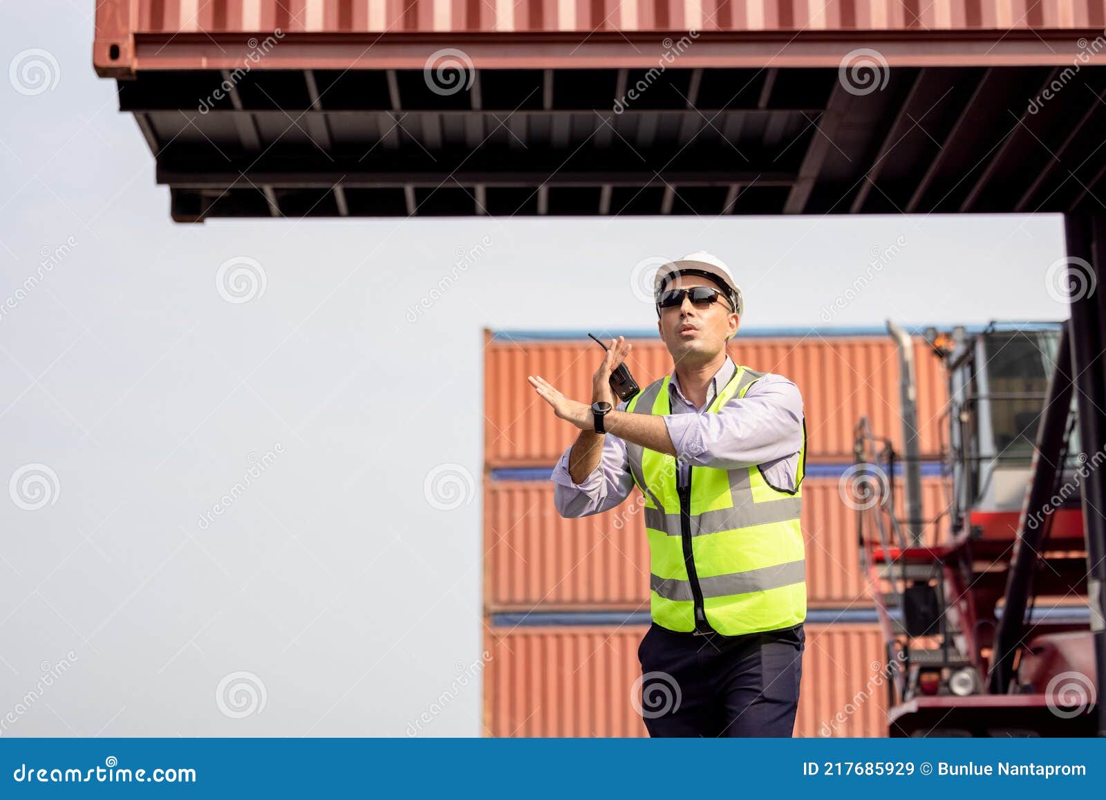 Man Using Walkie Talkie at Container Terminal, Industrial Worker is ...