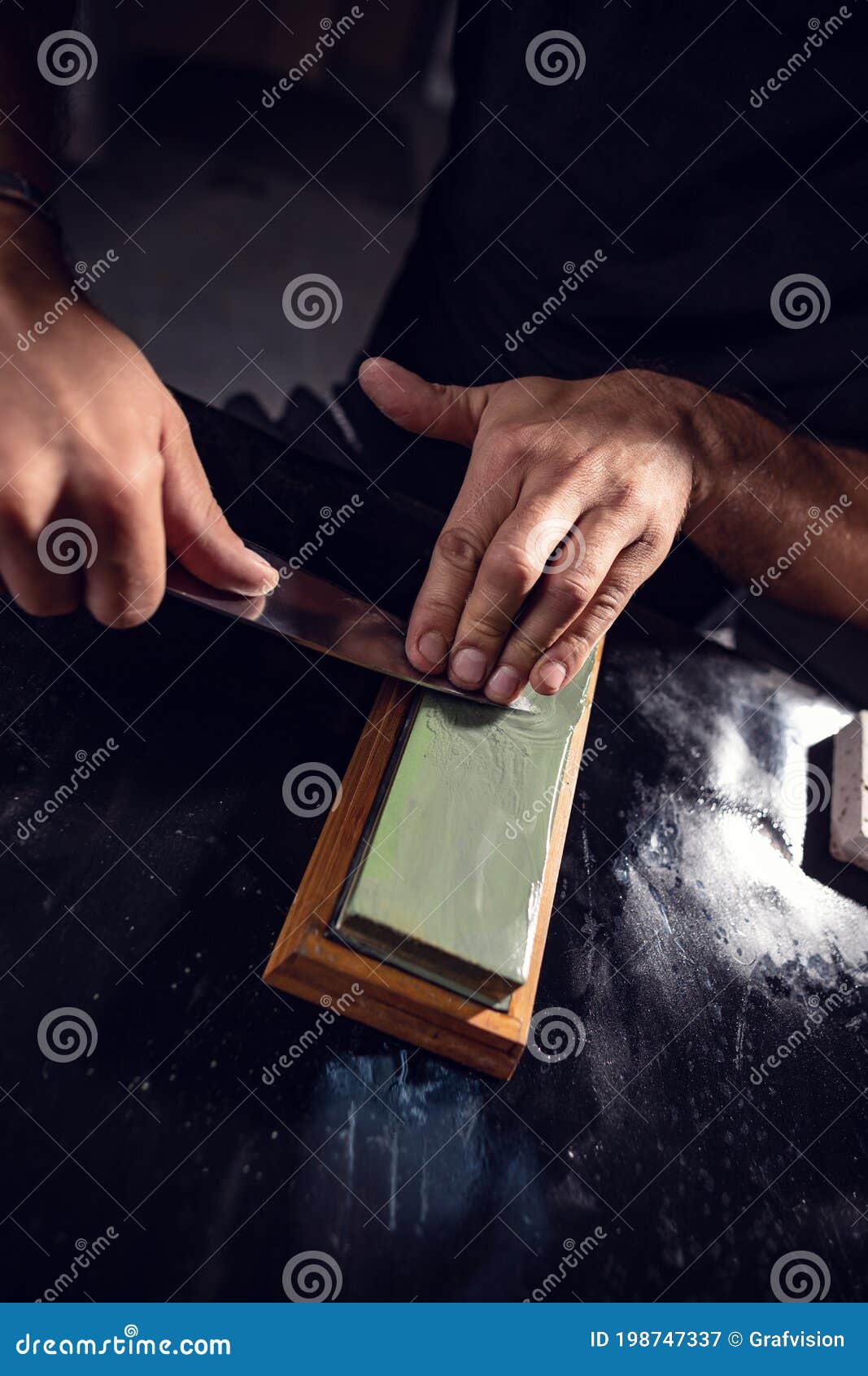 Man Using A Whetstone To Sharp His Pocket Knife Royalty-Free Stock ...