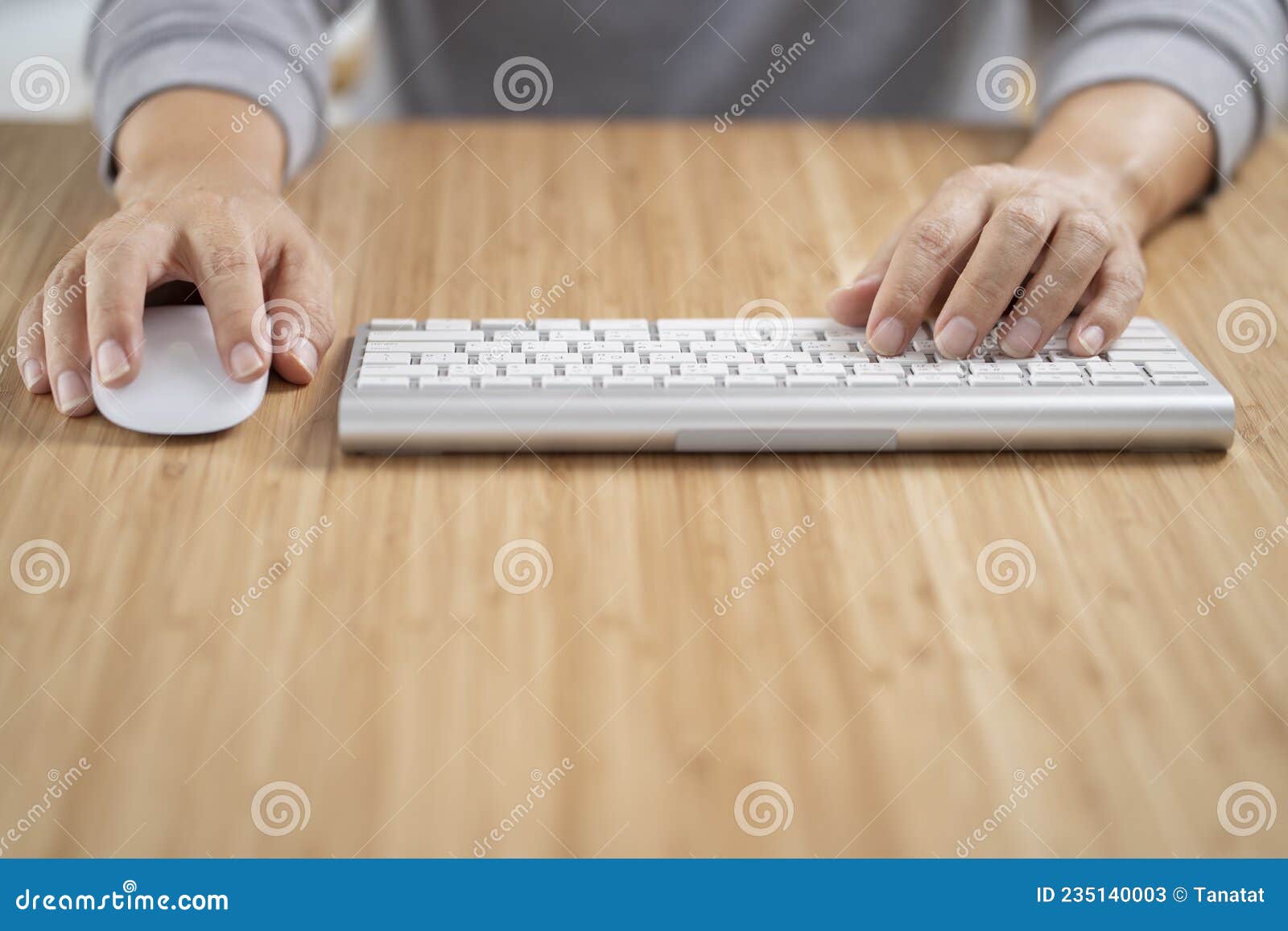 Man Using White Computer Keyboard and Mouse on the Wooden Desk Stock ...