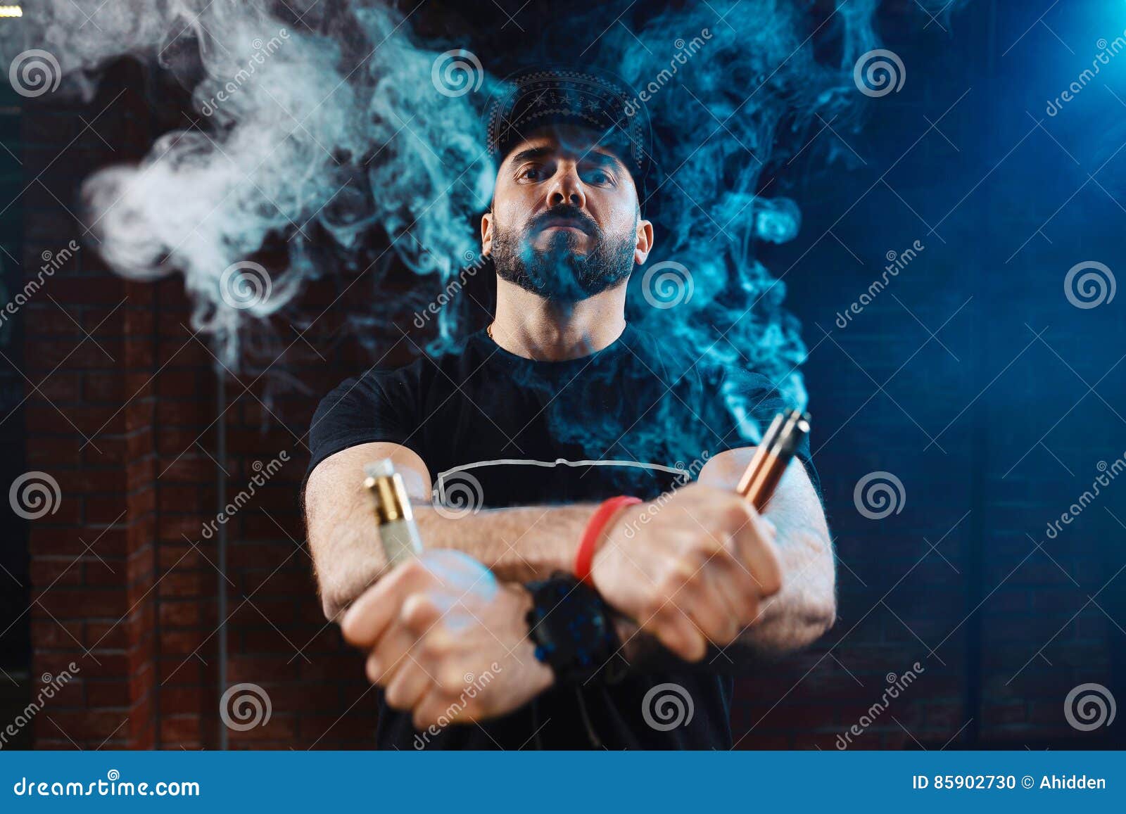 Man Vaping an Electronic Cigarette Stock Photo - Image of coil, smoker ...