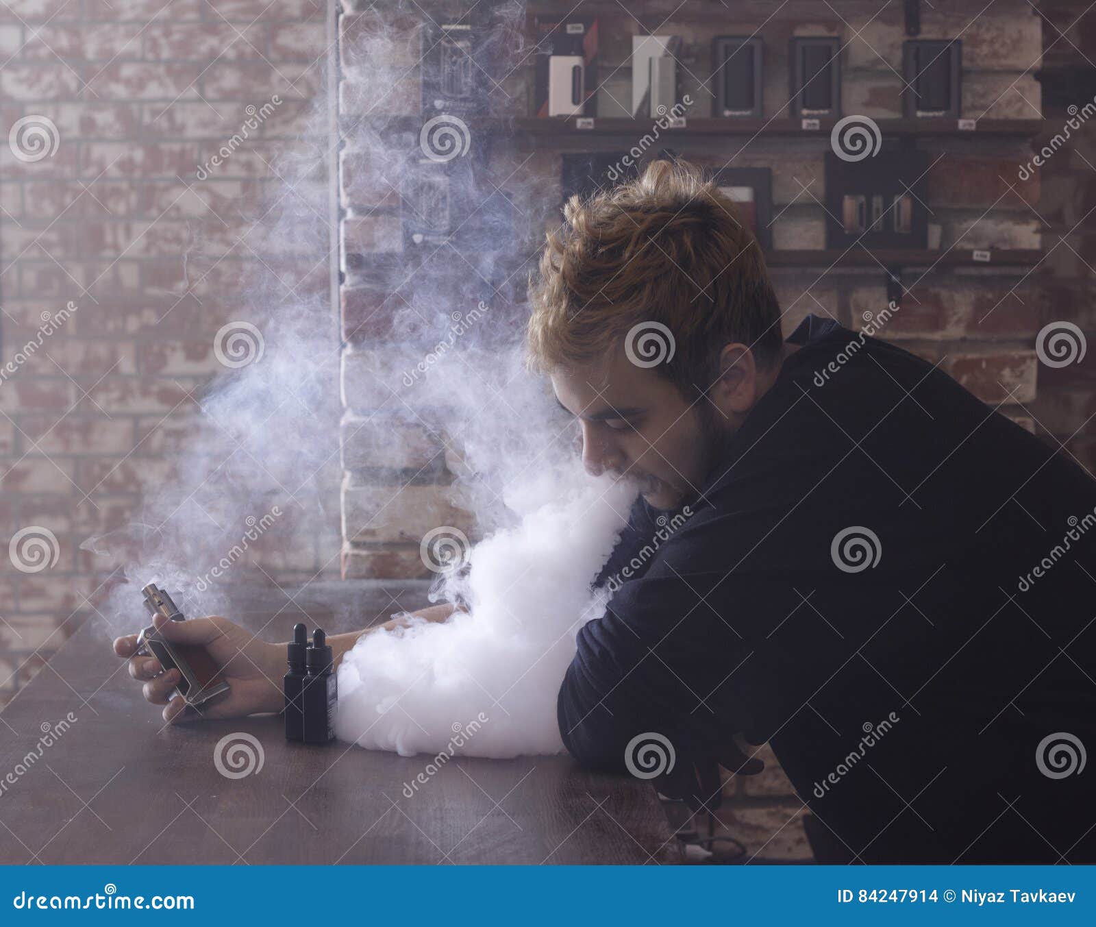 Man at the Vaping Store stock photo. Image of atomizer - 84247914