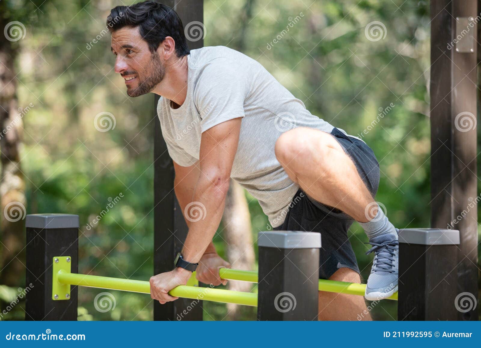 Man Vaulting Over Bars in Park Stock Image - Image of male, athletic ...