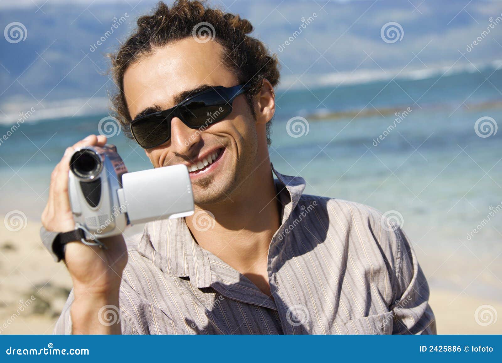 Man with video camera. stock photo. Image of 070212f0003 - 2425886