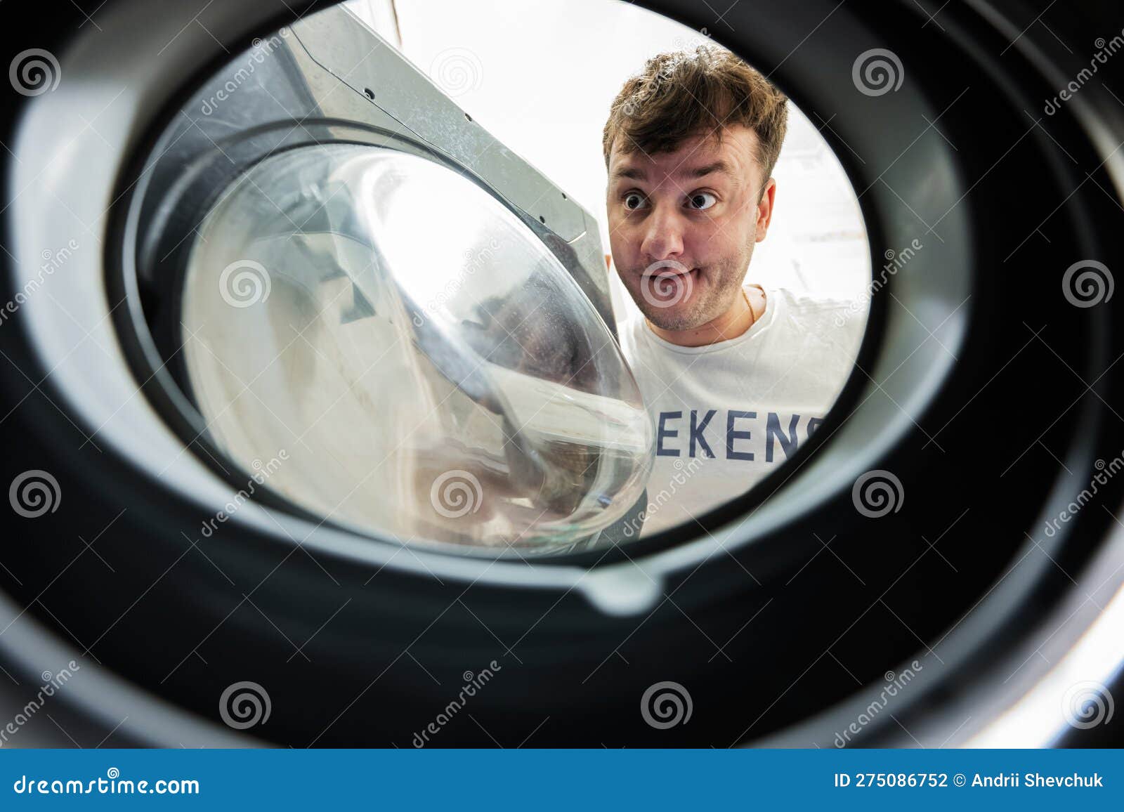 Man View from Washing Machine Inside. Male Does Laundry daily Routine ...
