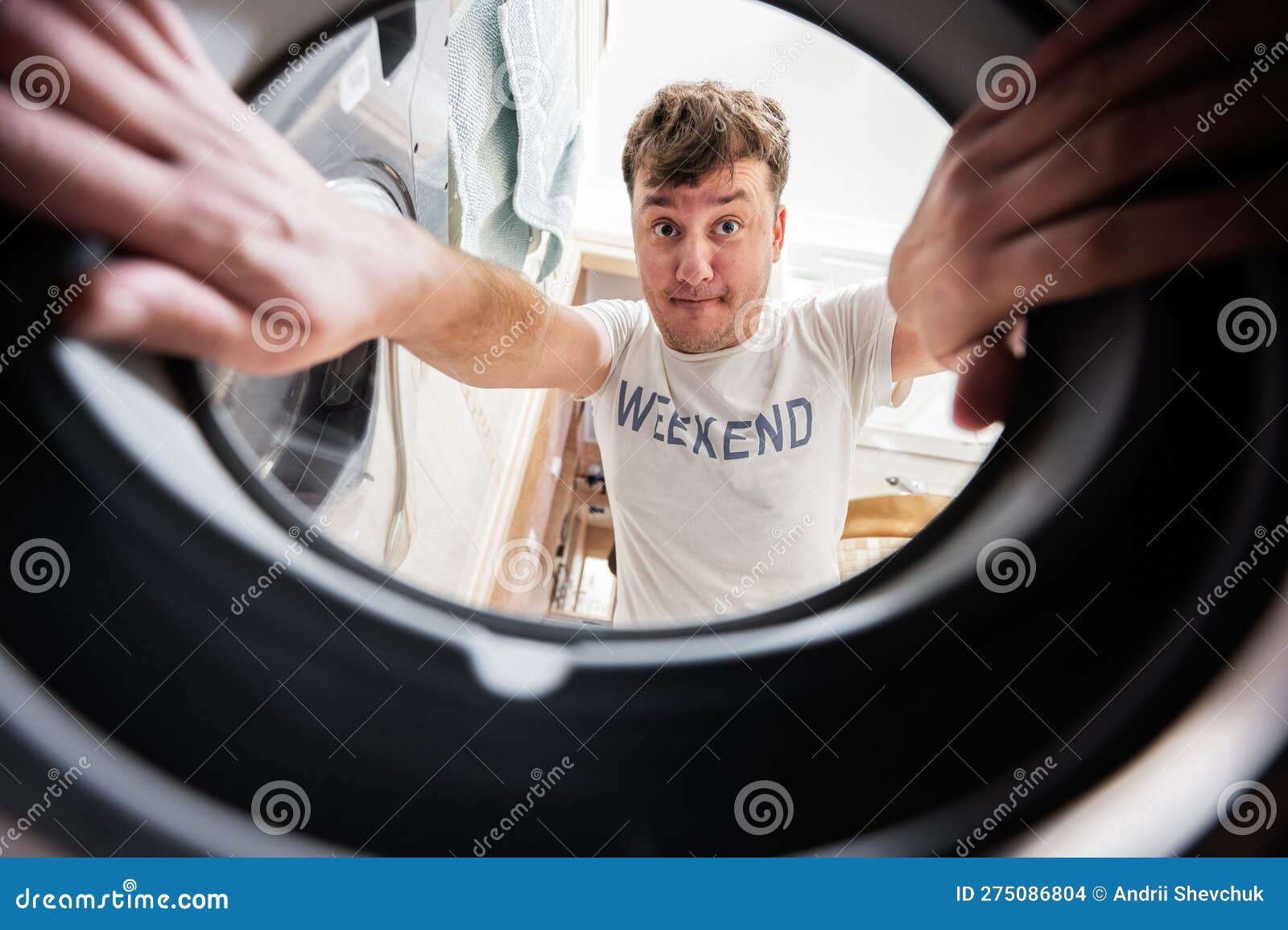 Man View from Washing Machine Inside. Male Does Laundry daily Routine ...