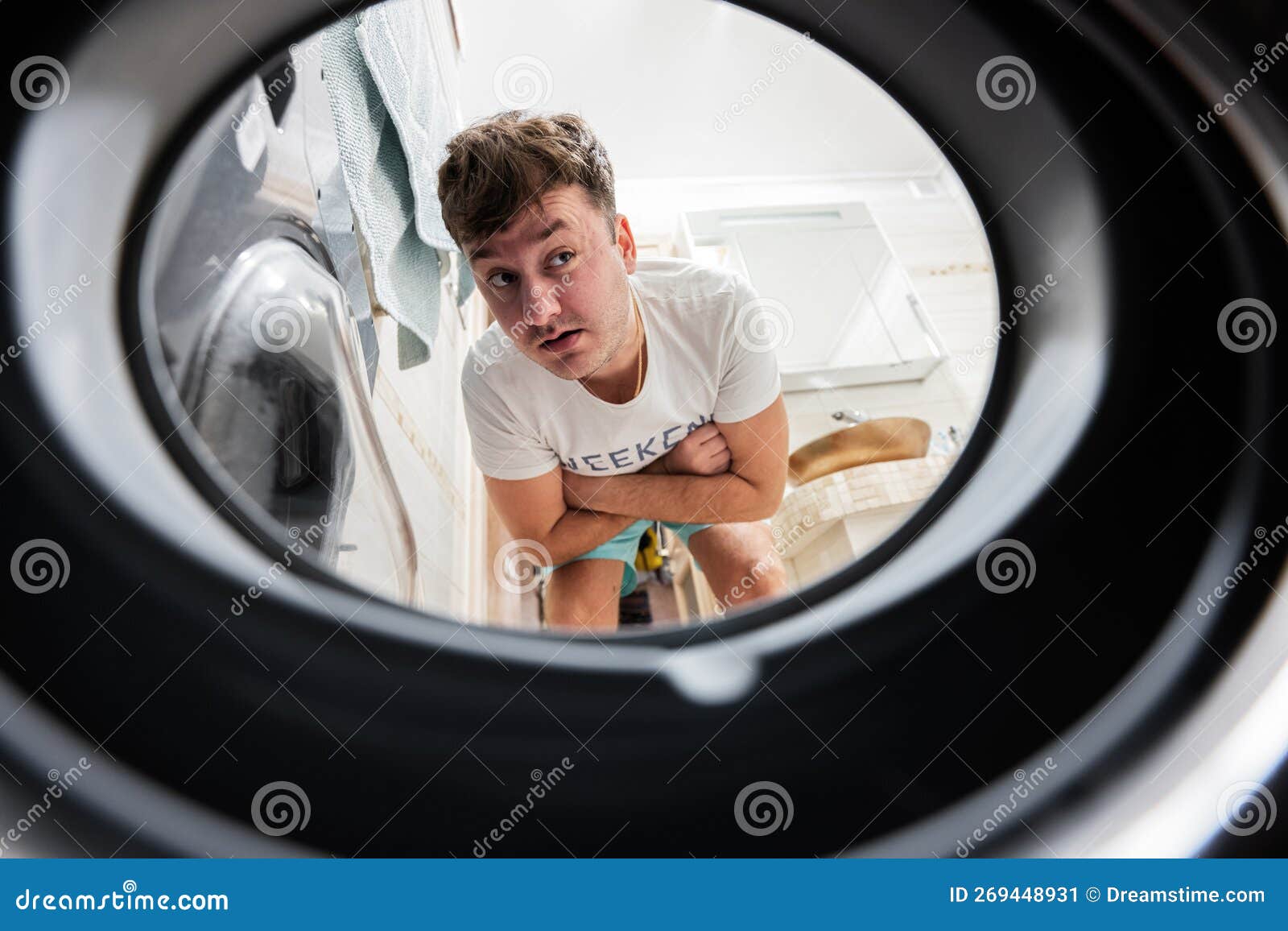 Man View from Washing Machine Inside. Male Does Laundry daily Routine ...