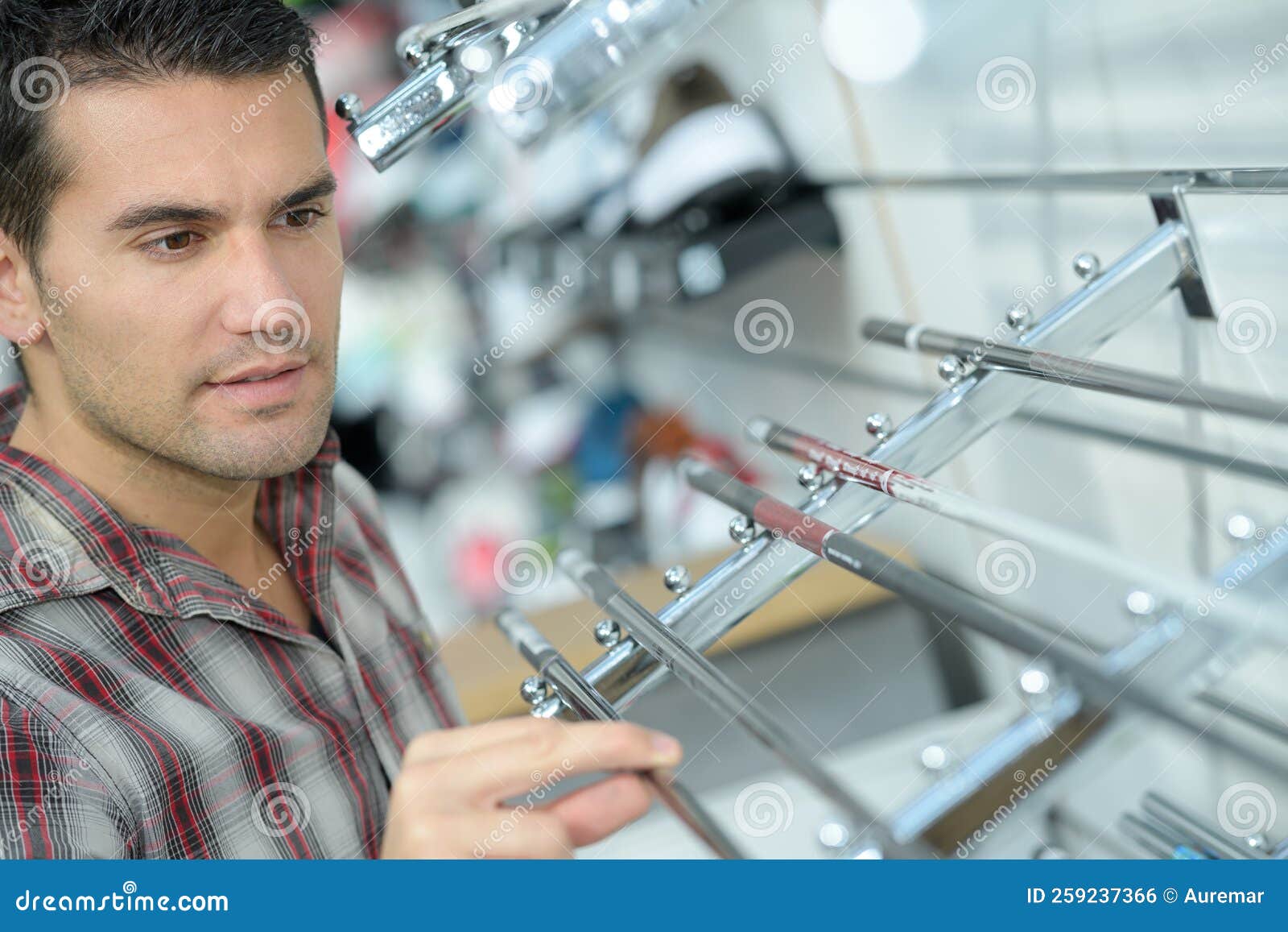 Man viewing metal rack stock photo. Image of factory - 259237366