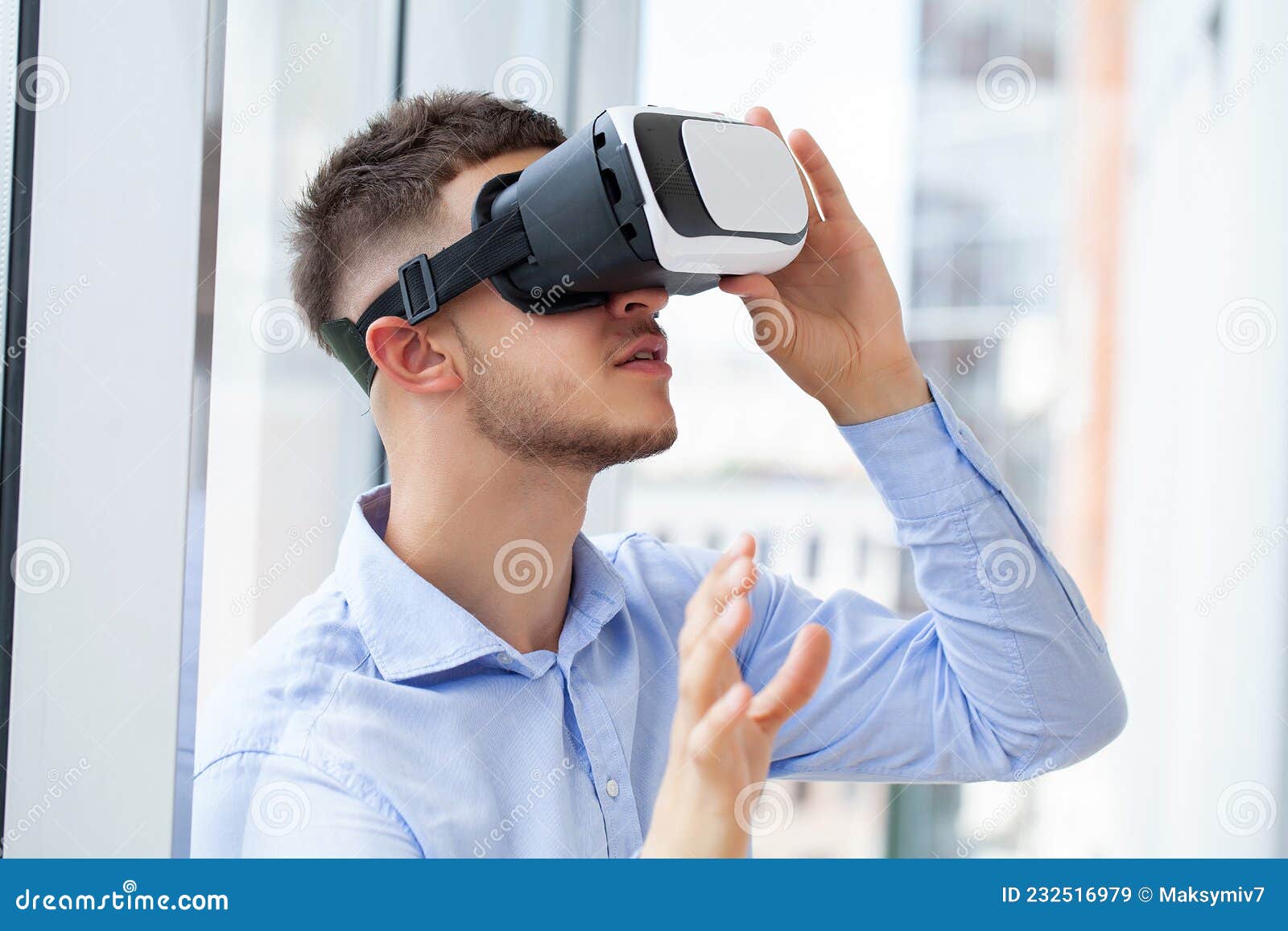 Man in VR Headset Trying To Touch Objects in Virtual Reality Stock ...