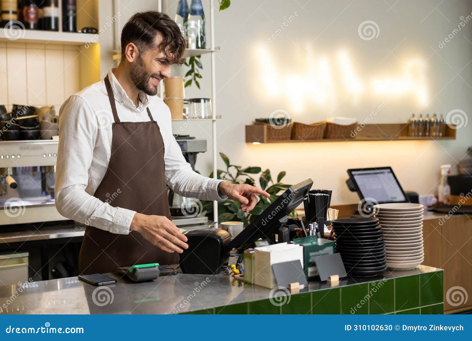Man Waiter Working in Coffee Shop Using Terminal while Standing at ...
