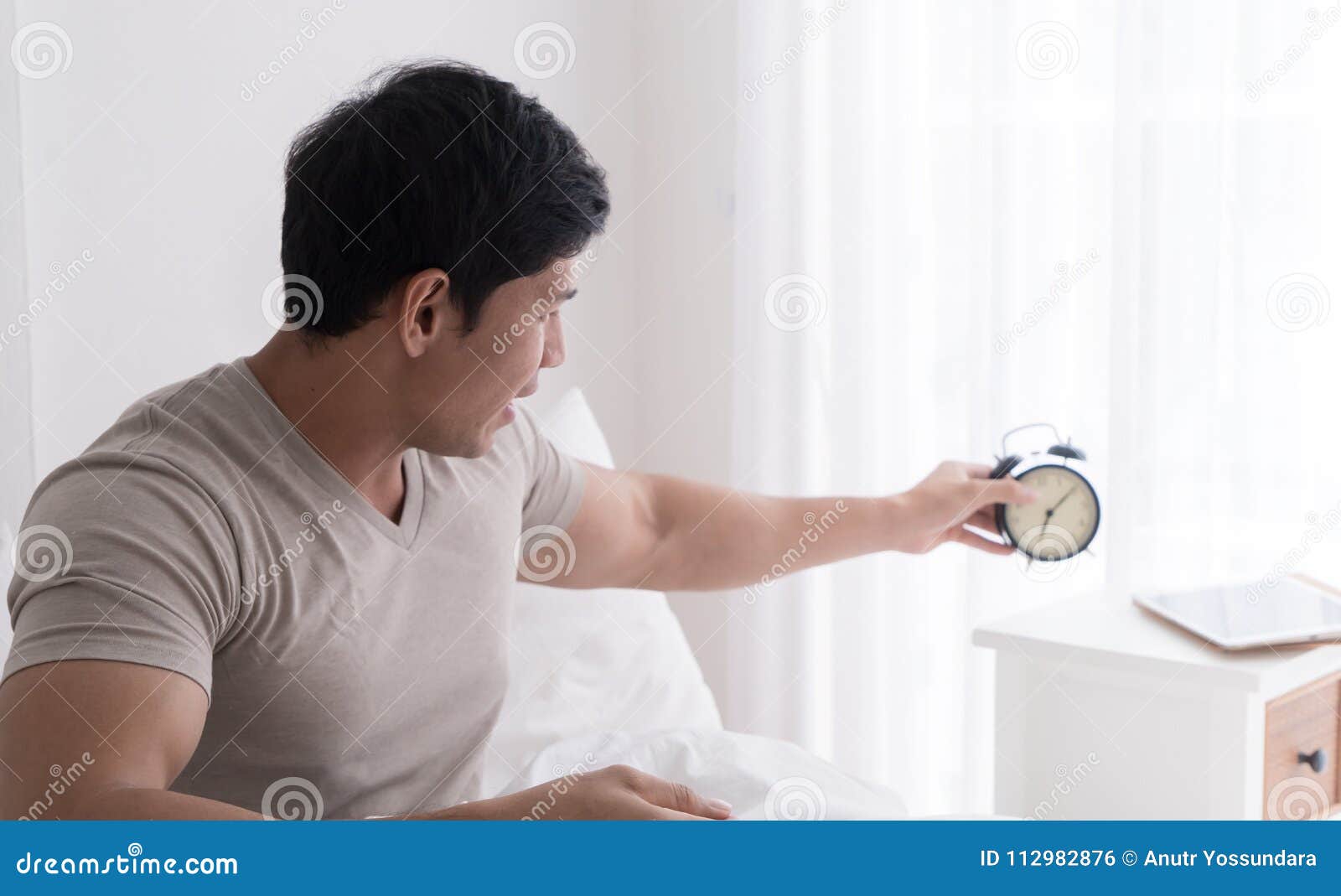 Man Wake Up and Stop Alarm Clock with Optimistic Feeling Stock Photo ...