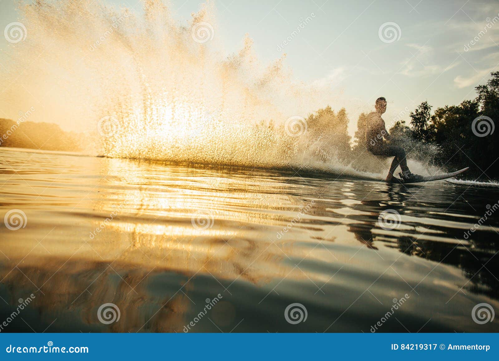 Man wakeboarding on a lake stock image. Image of speed - 84219317