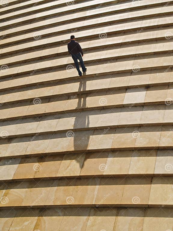 Man walking alone upstairs stock photo. Image of stair - 2271298