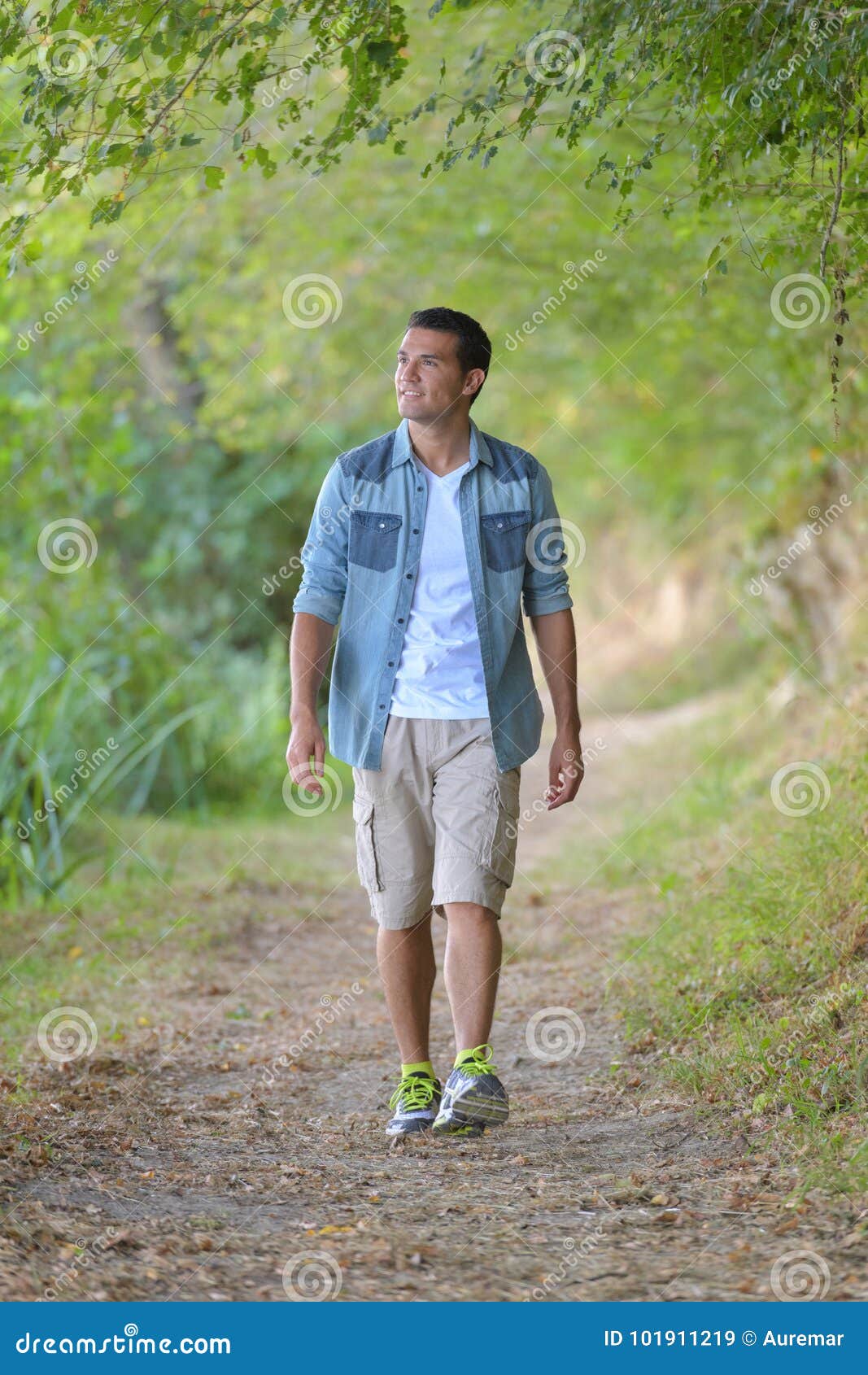 Man Walking Along Path in Countryside Stock Image - Image of outdoor ...