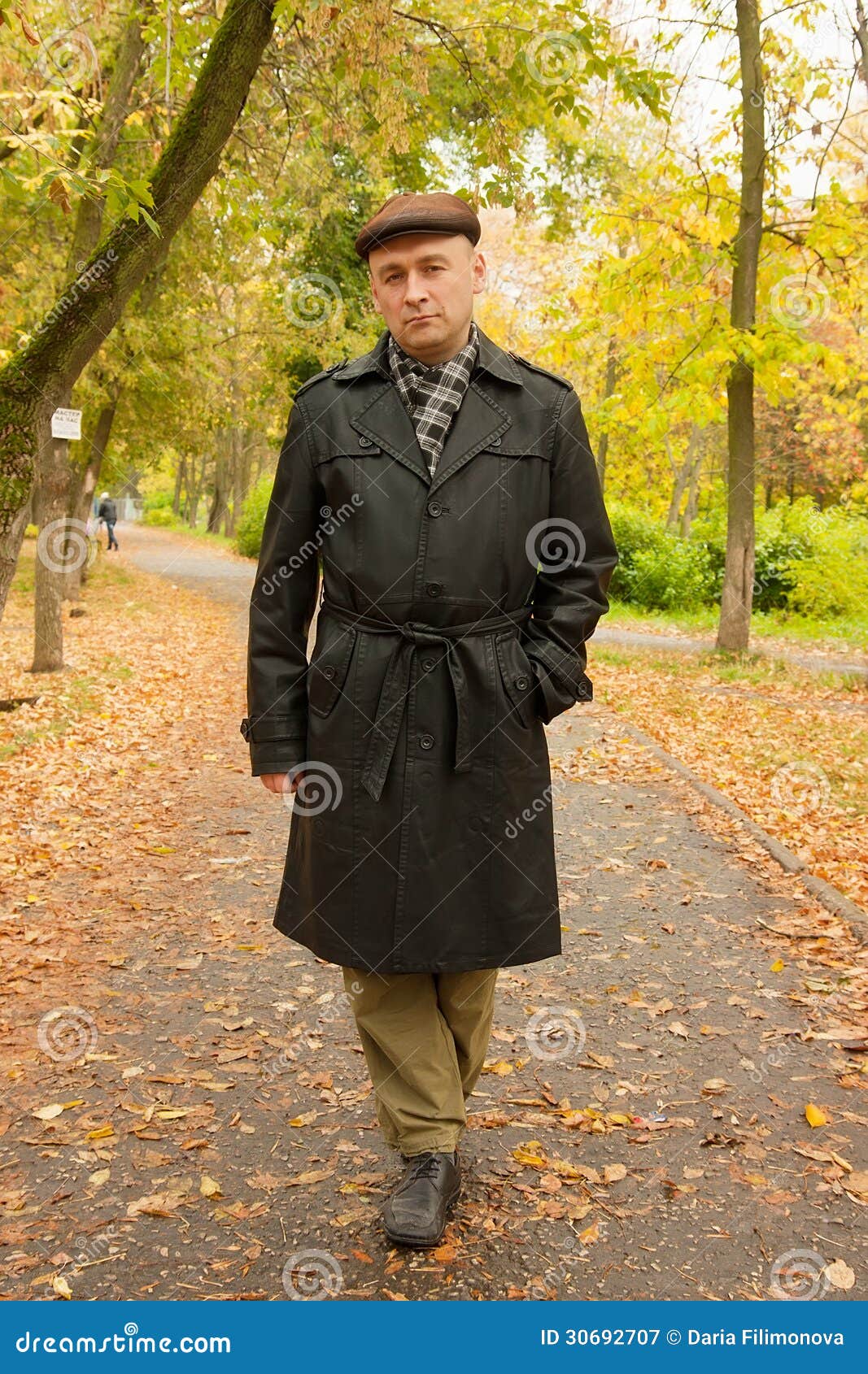 Man walking in autumn stock image. Image of rain, black - 30692707