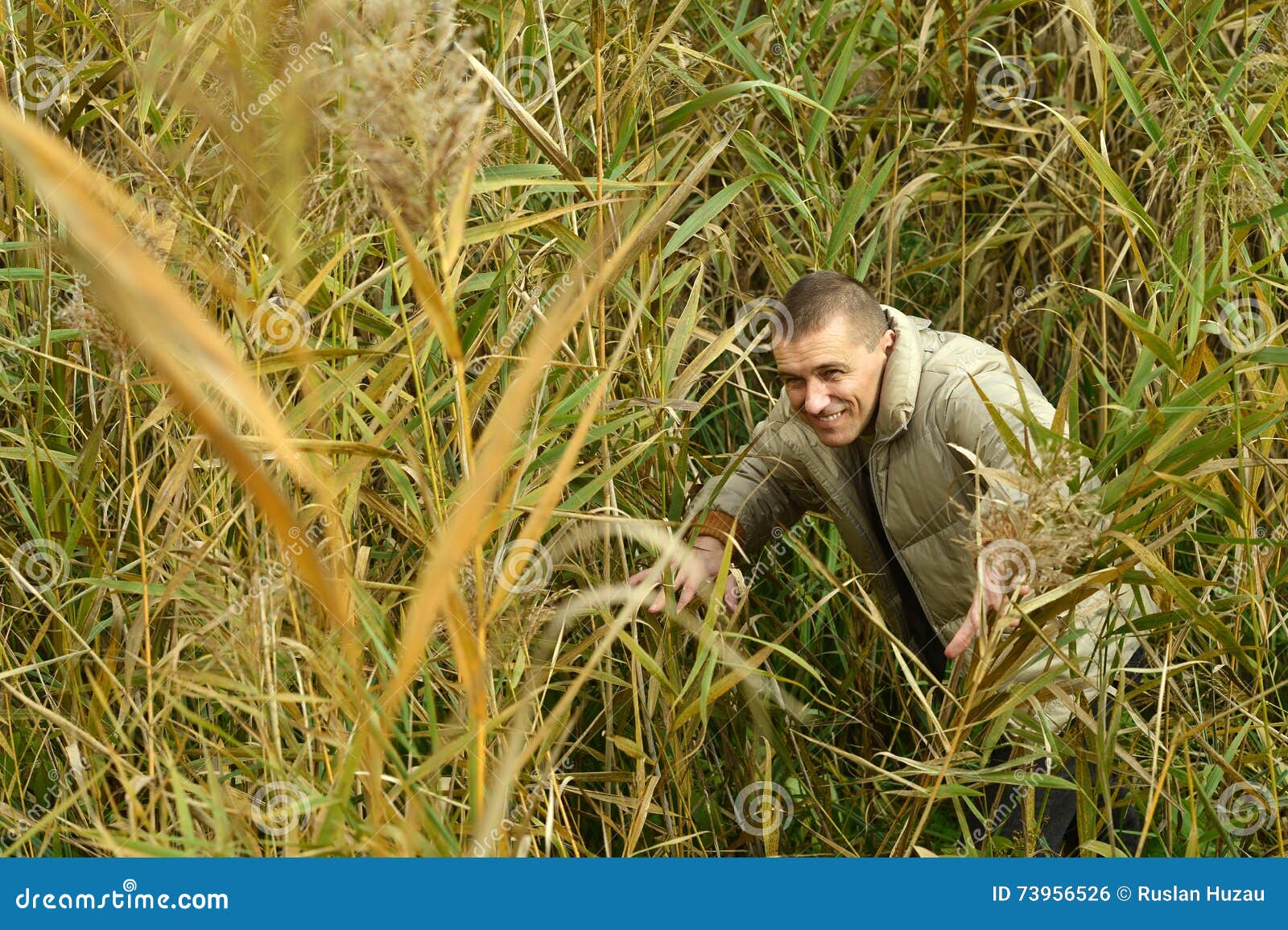 Man Walking in Autumn Forest Stock Photo - Image of people, looking ...