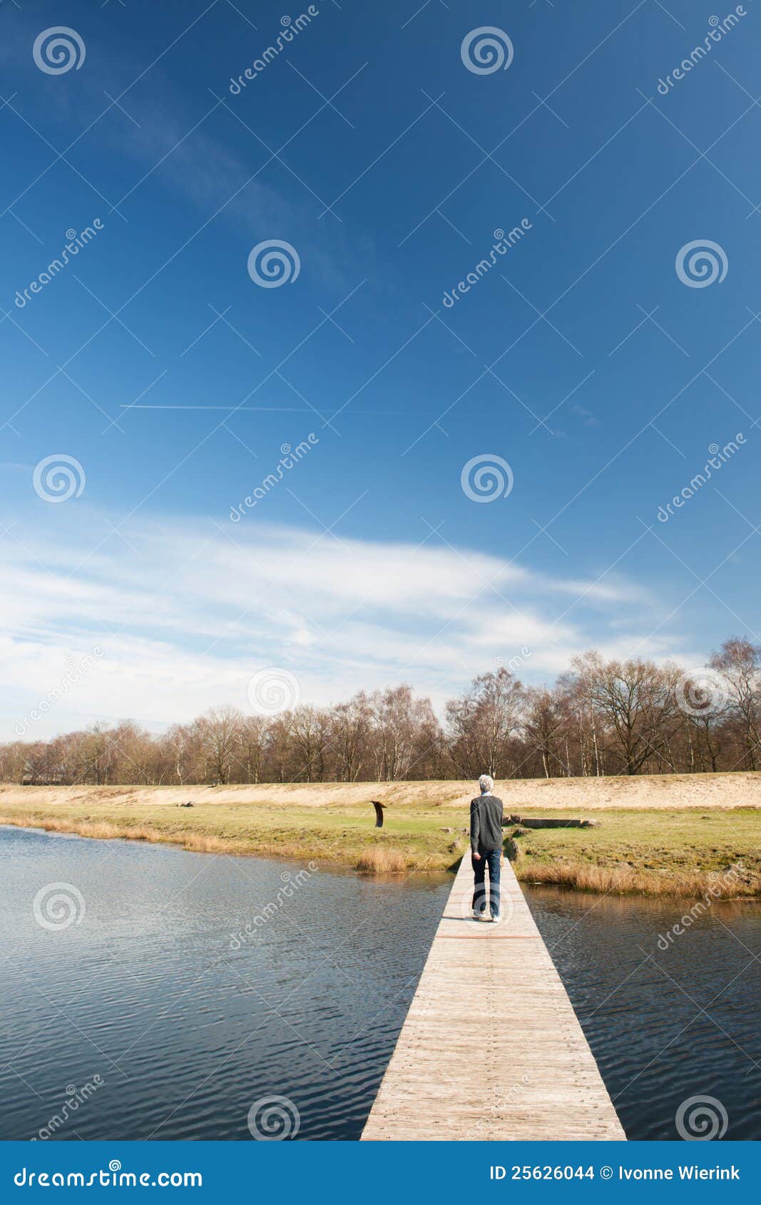 Man Walking Away Over Water Stock Photo - Image of wooden, holland ...