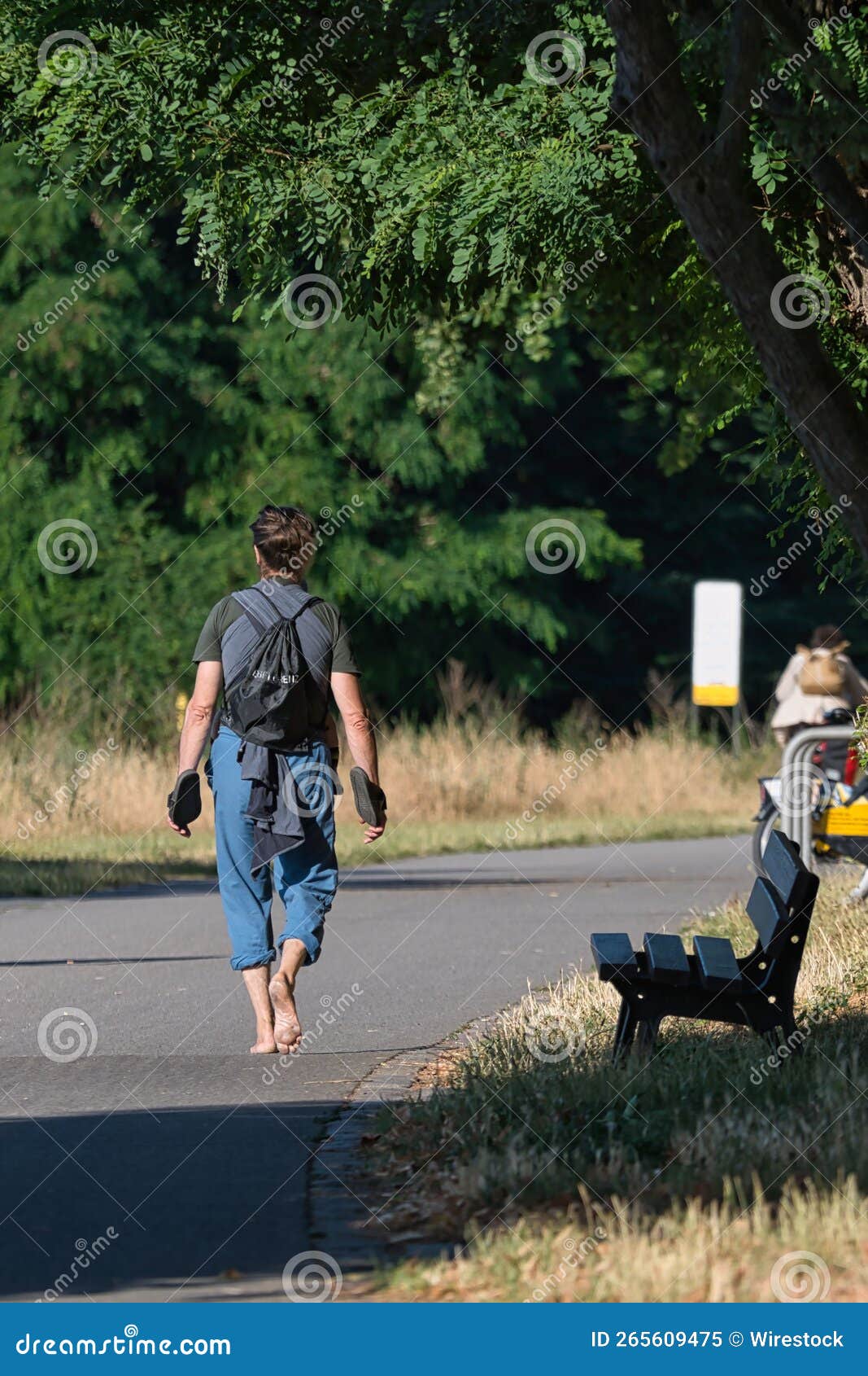 Man walking barefoot stock image. Image of outdoors - 265609475