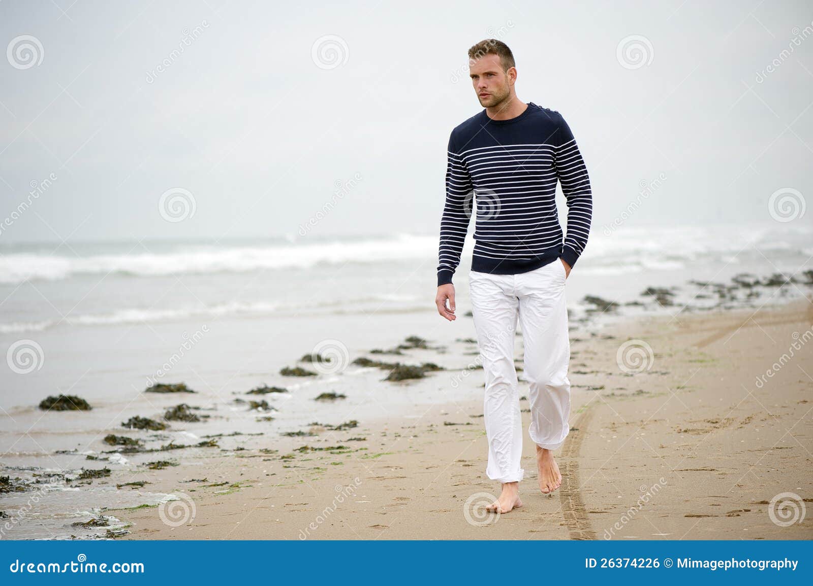 A Man Walking on the Beach stock photo. Image of beautiful - 26374226