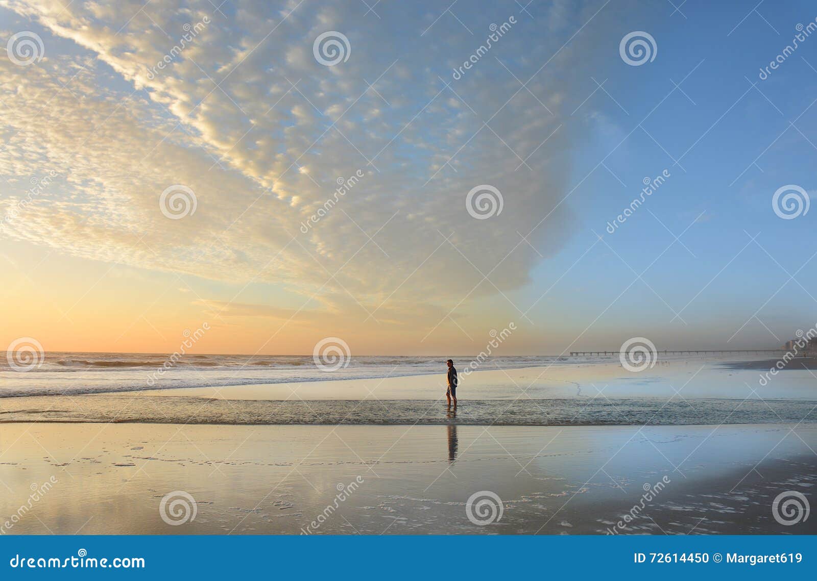 Man Walking on the Beach at Beautiful Sunrise. Stock Photo - Image of ...
