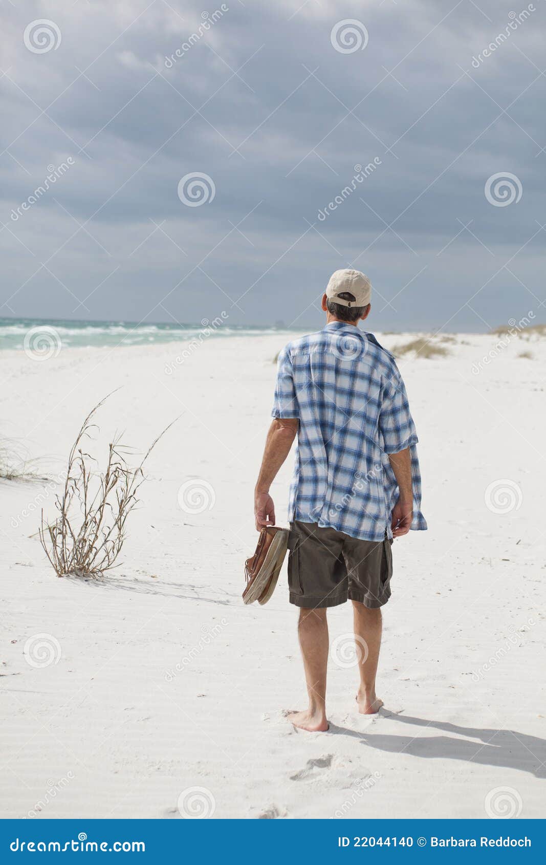 Man Walking on a Beautiful Beach Stock Photo - Image of overcast ...