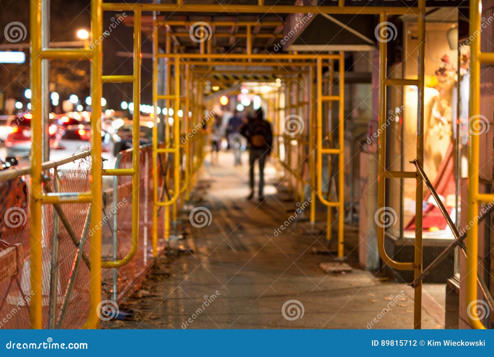 Man Walking through Construction Scaffolding Stock Photo - Image of ...