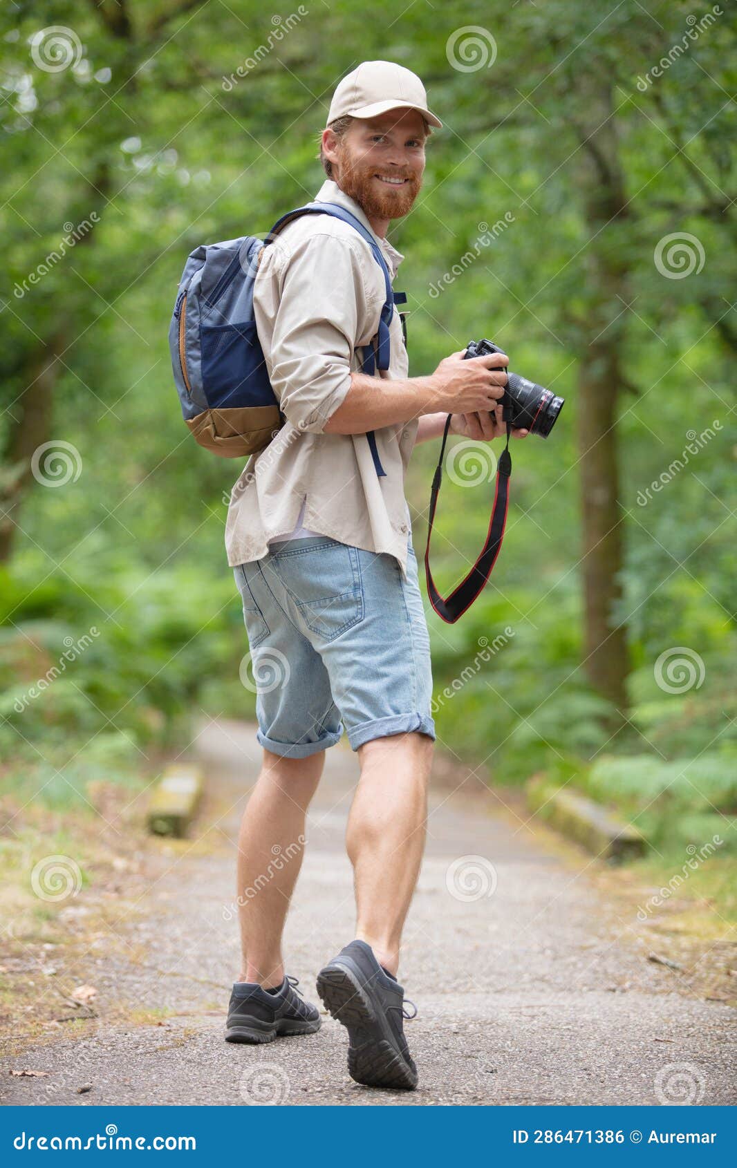 Man Walking in Countryside Carrying Camera Stock Photo - Image of adult ...