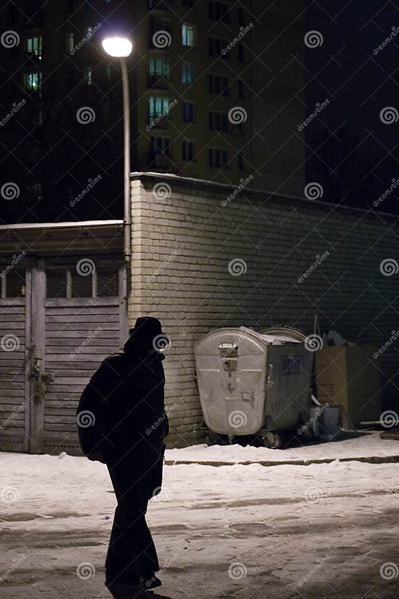 Man walking in the dark stock image. Image of dumpster - 8354543
