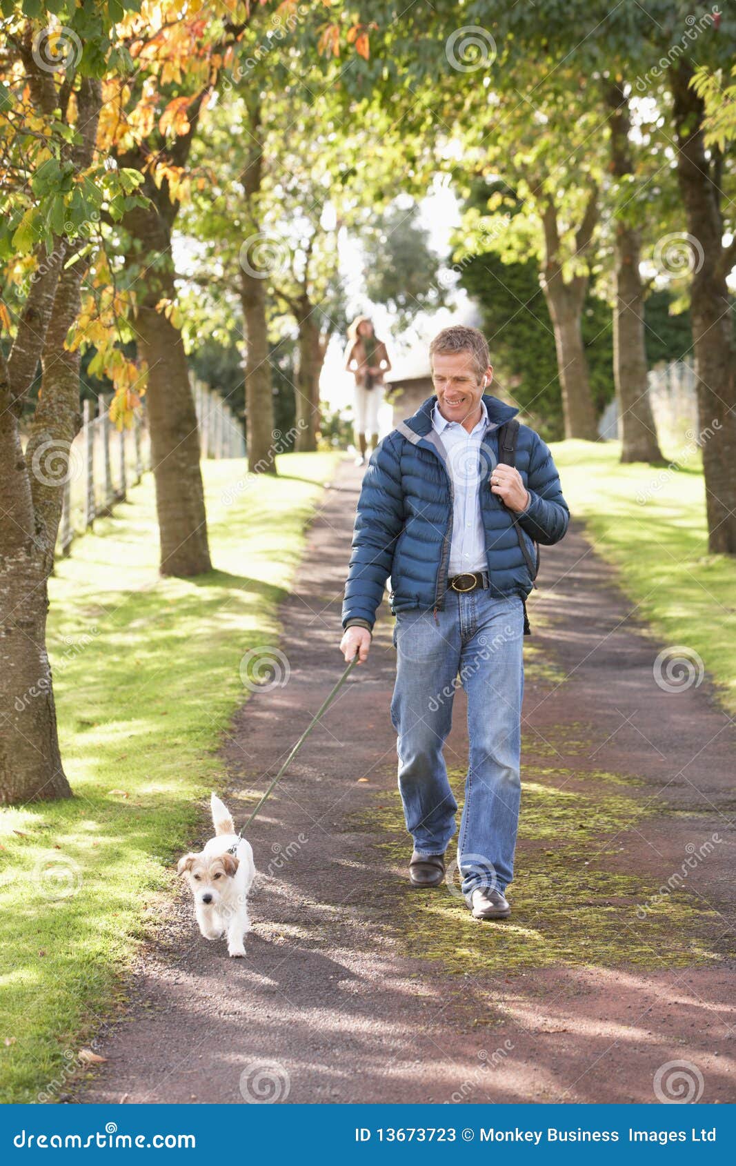 Man Walking Dog Outdoors in Autumn Park Stock Image - Image of person ...