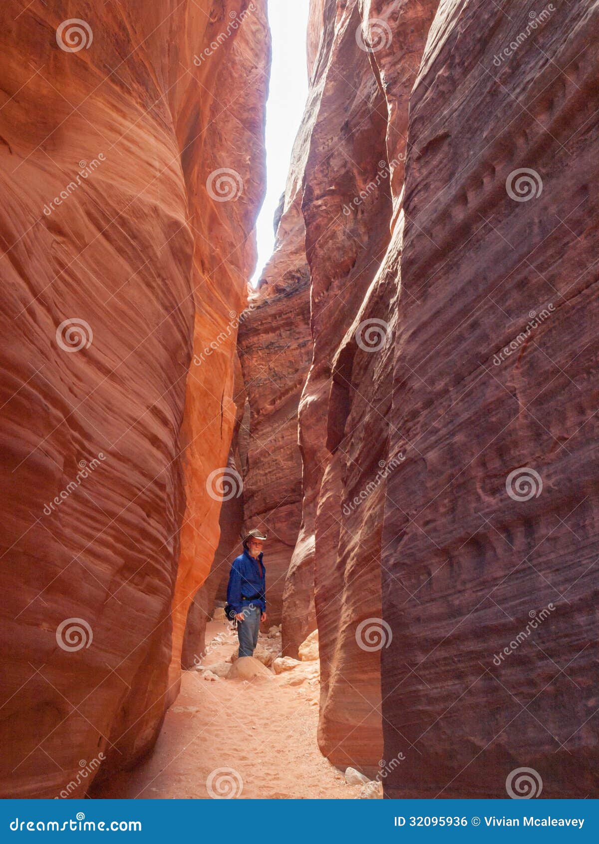 Man Walking Down Narrow Canyon Stock Photo - Image of stream, arizona ...