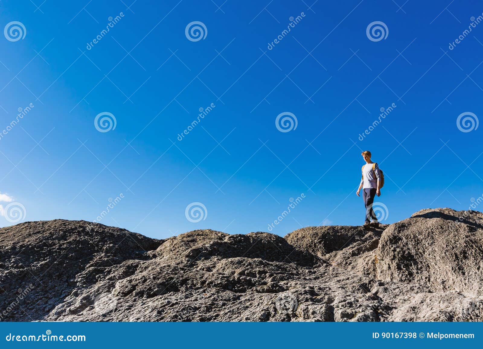 Man Walking on the Edge of a Cliff Stock Photo - Image of overlook ...