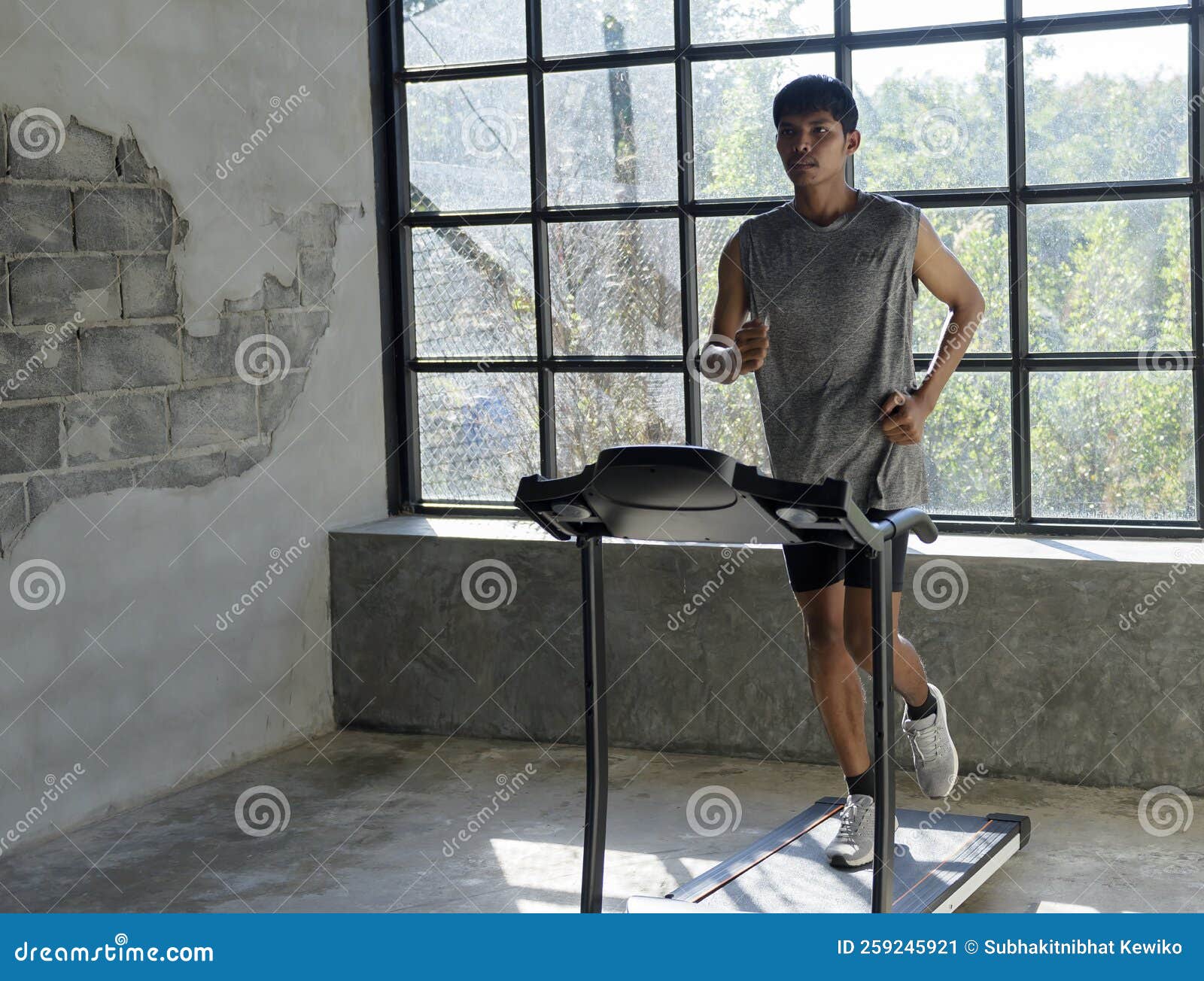 A Man Walking and Exercising on a Treadmill Stock Image - Image of ...