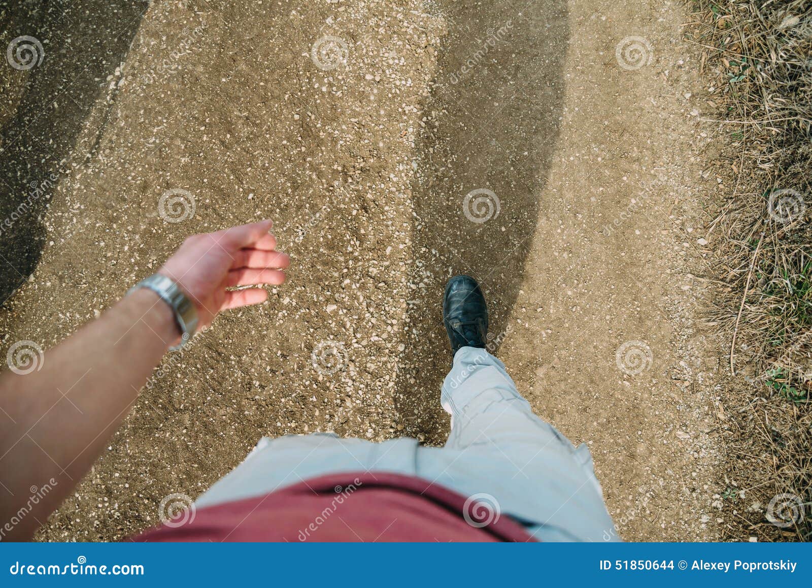 Man walking on footpath stock photo. Image of feet, road - 51850644