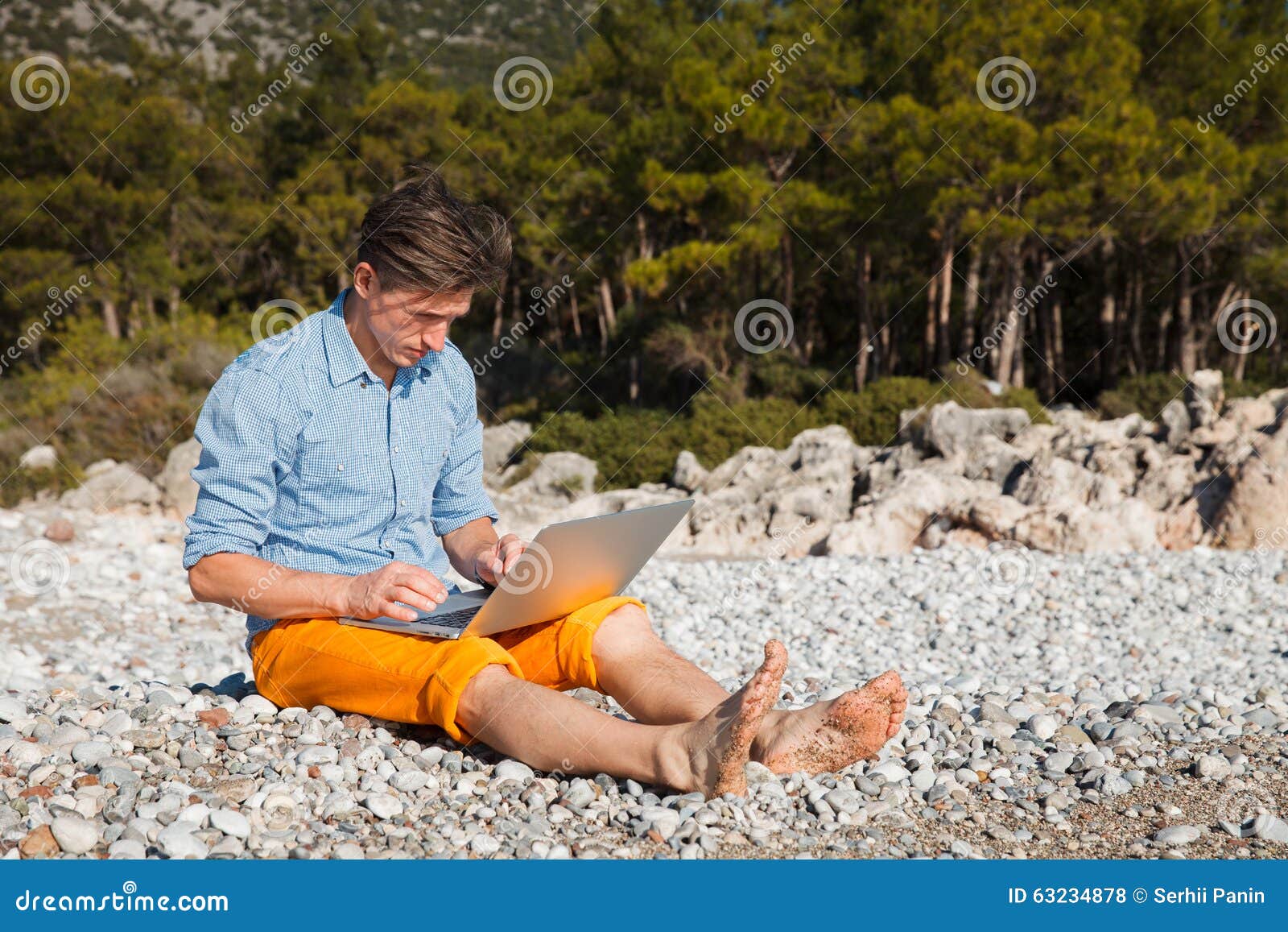 Man Walking with Laptop Computer by the Sea Coast Stock Photo - Image ...