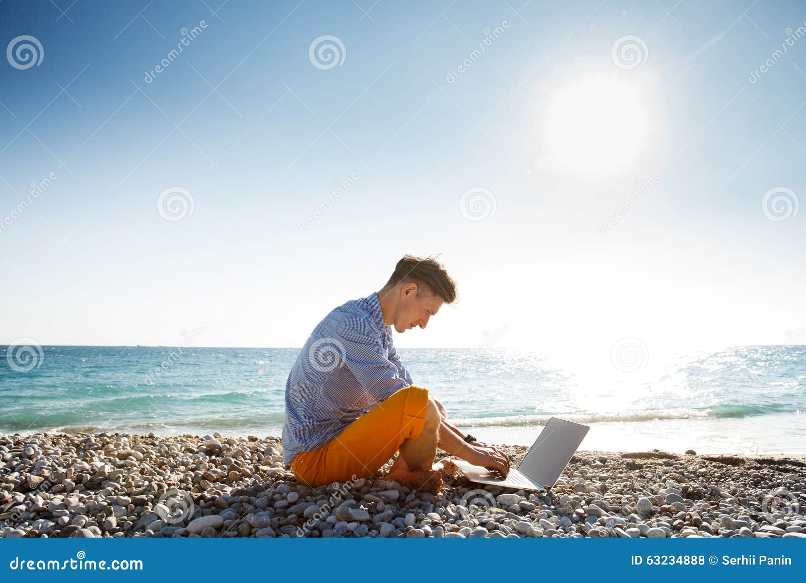 Man Walking with Laptop Computer by the Sea Coast Stock Photo - Image ...