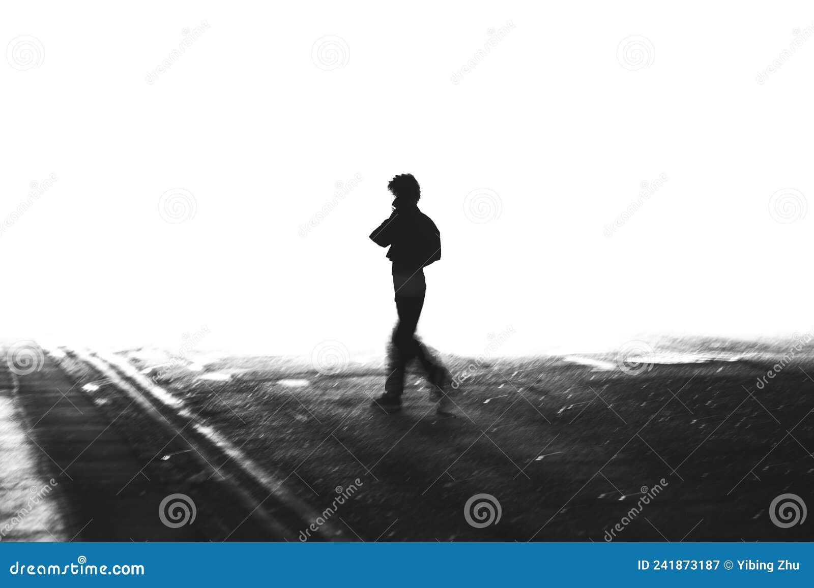 Man walking into the light stock image. Image of lonely - 241873187