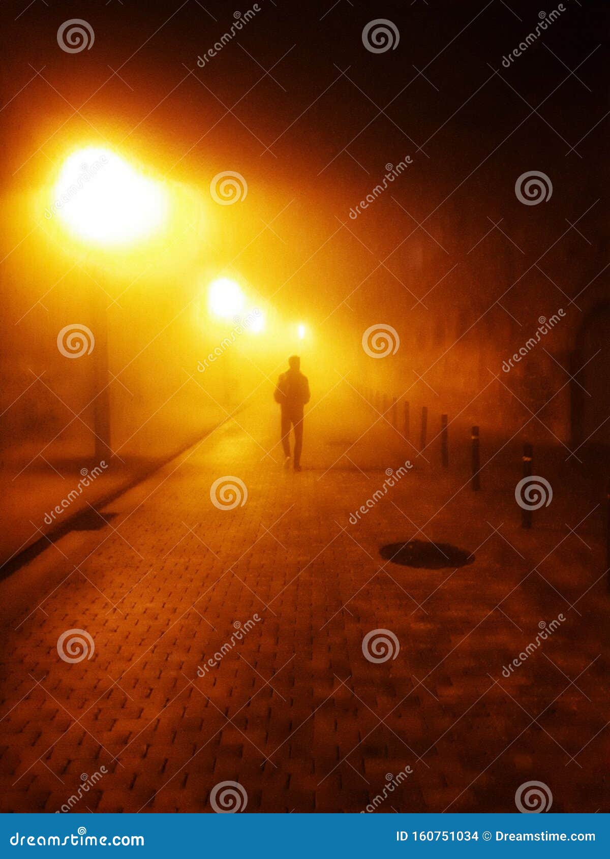 Man walking in the night stock photo. Image of night - 160751034
