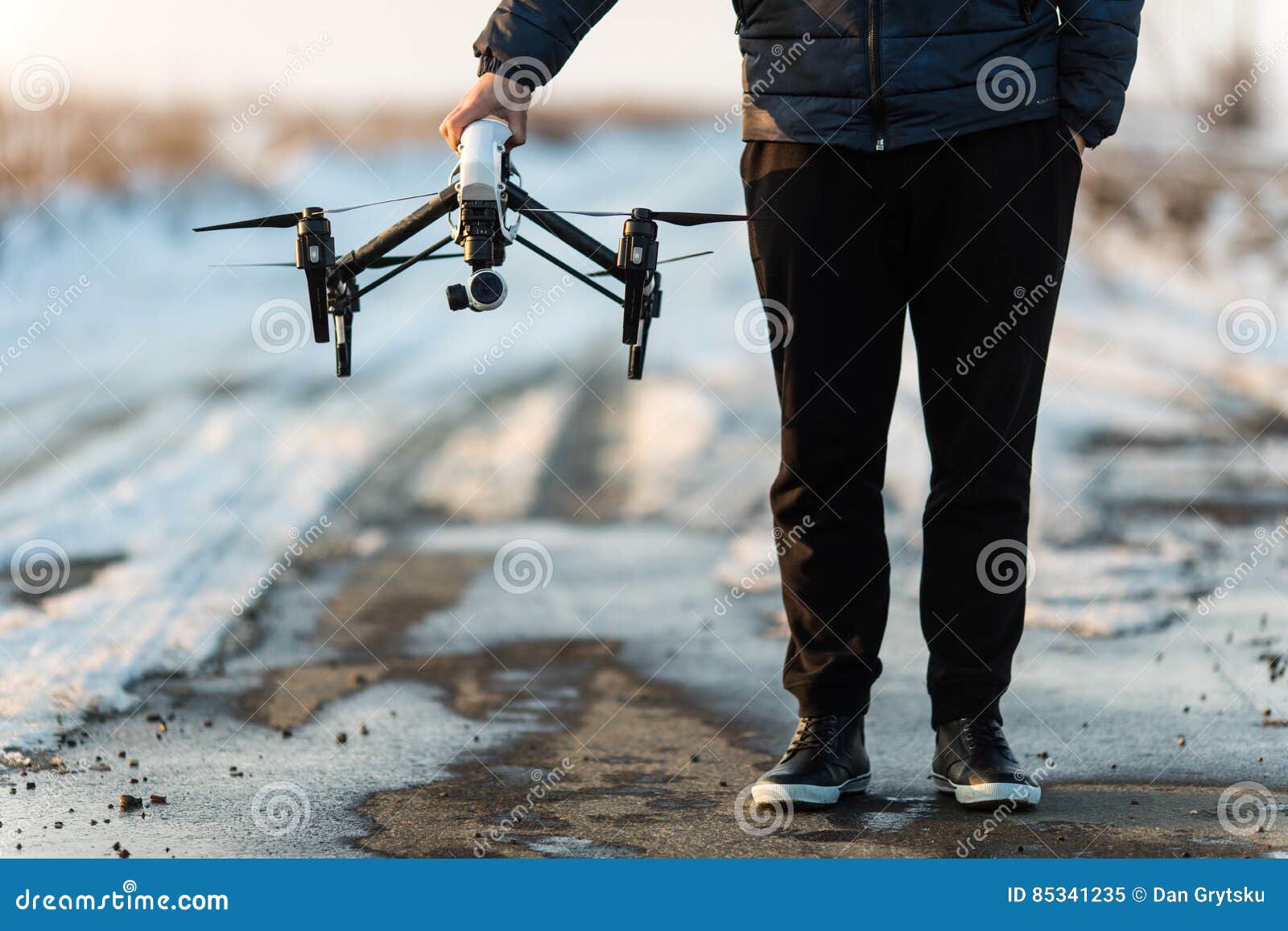 Man Walking and Preparing White Drone with Digital Camera for Flying ...