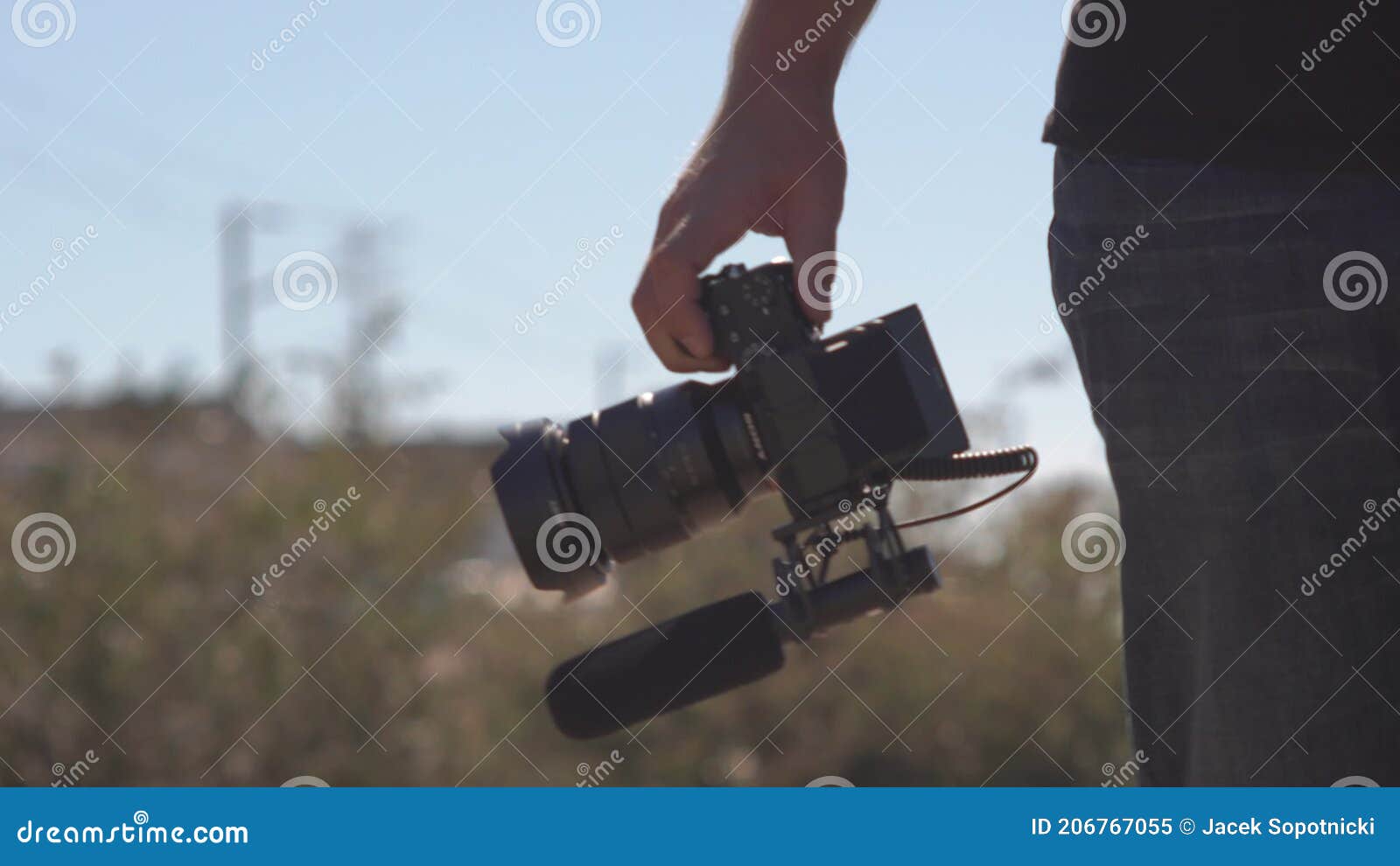 Man Walking with a Professional Camera with a Microphone Stock Video ...