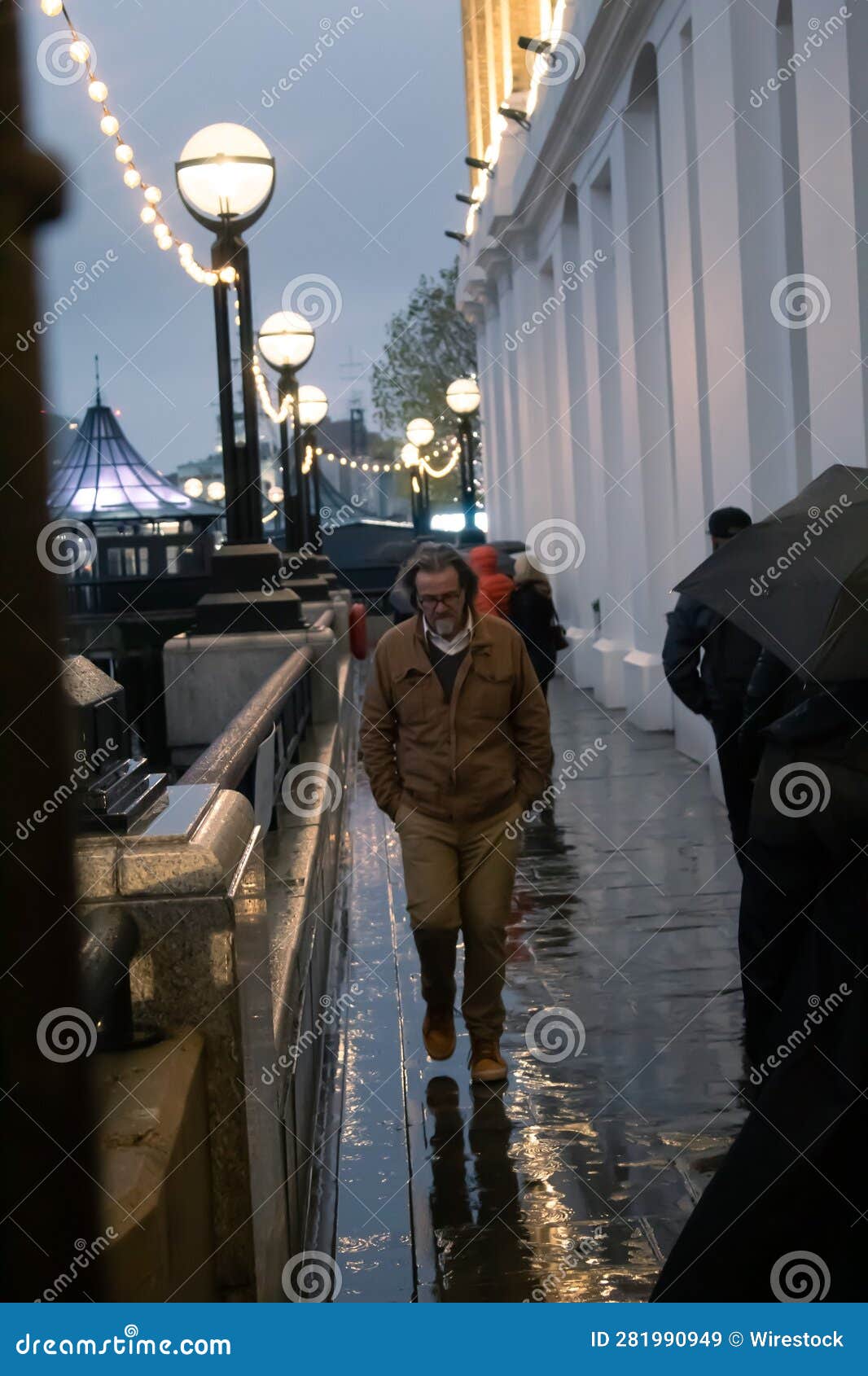 A man walking in the rain editorial stock image. Image of overcast ...