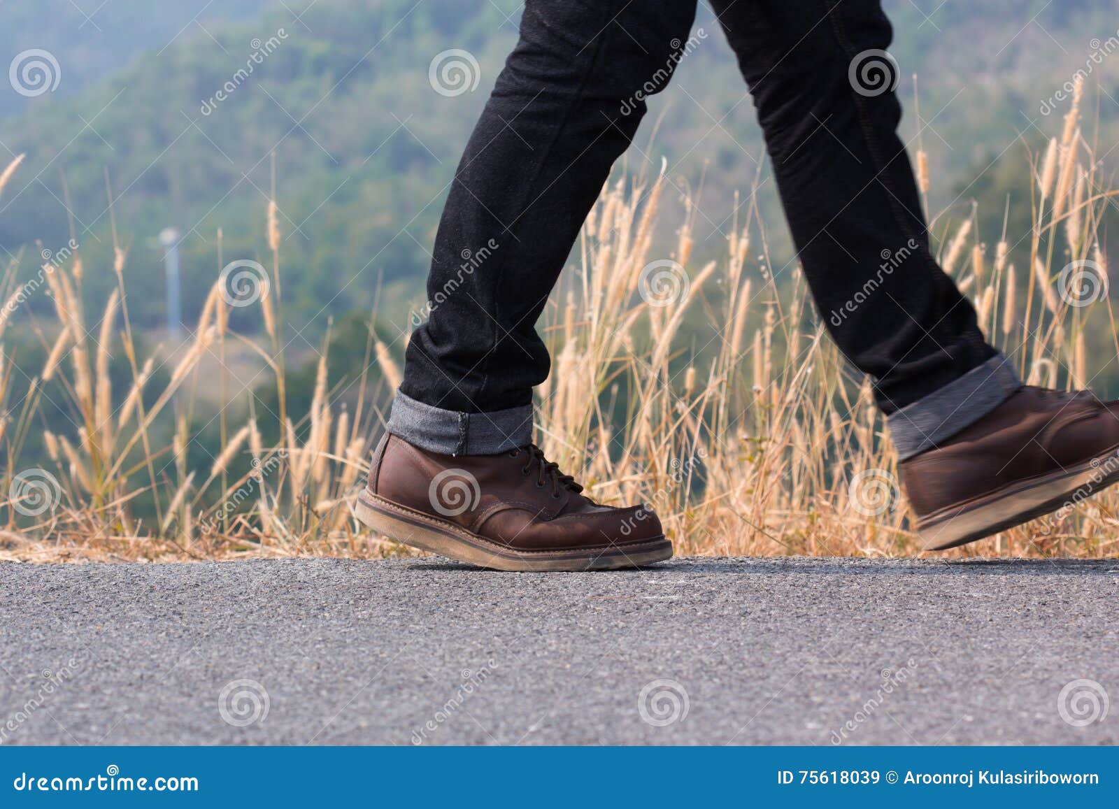 A man walking on the road stock image. Image of asphalt - 75618039