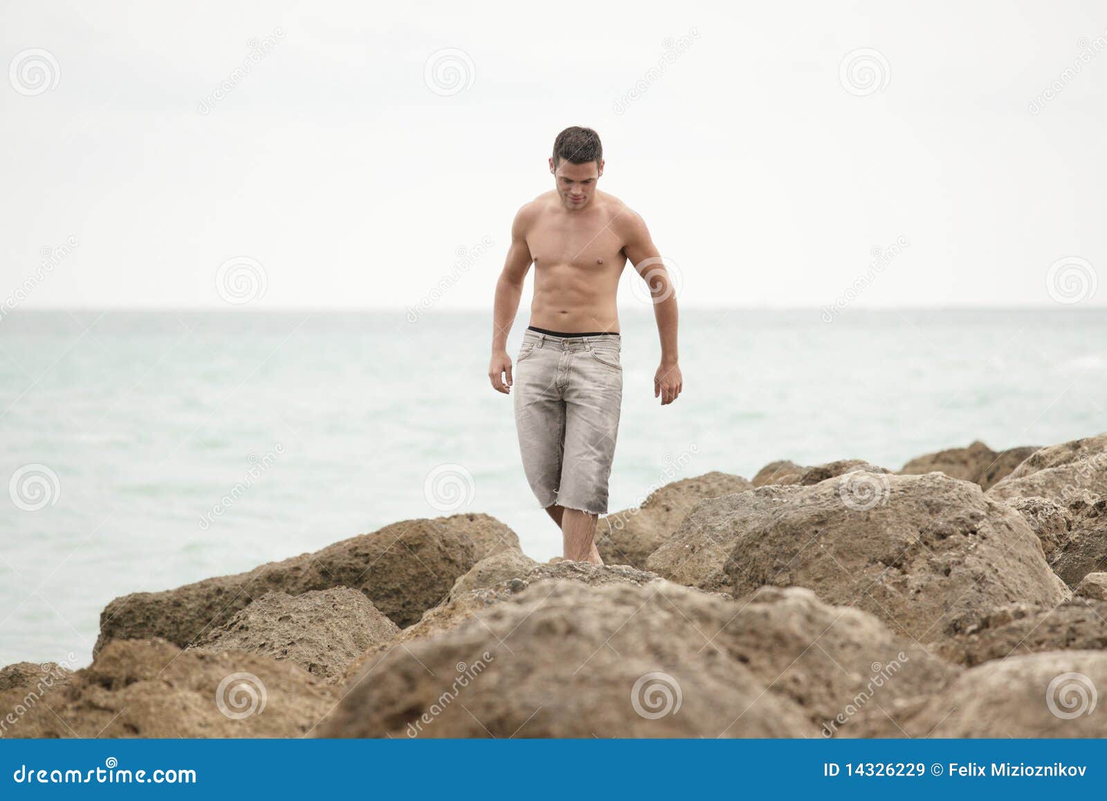 Man walking on the rocks stock image. Image of caucasian - 14326229