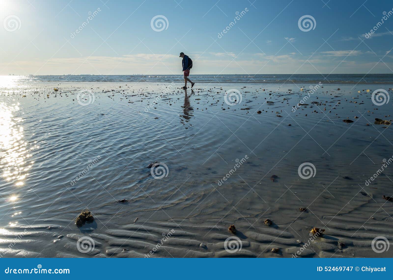 Man Walking on a Sandbar during Low Tide #2 Stock Image - Image of tide ...
