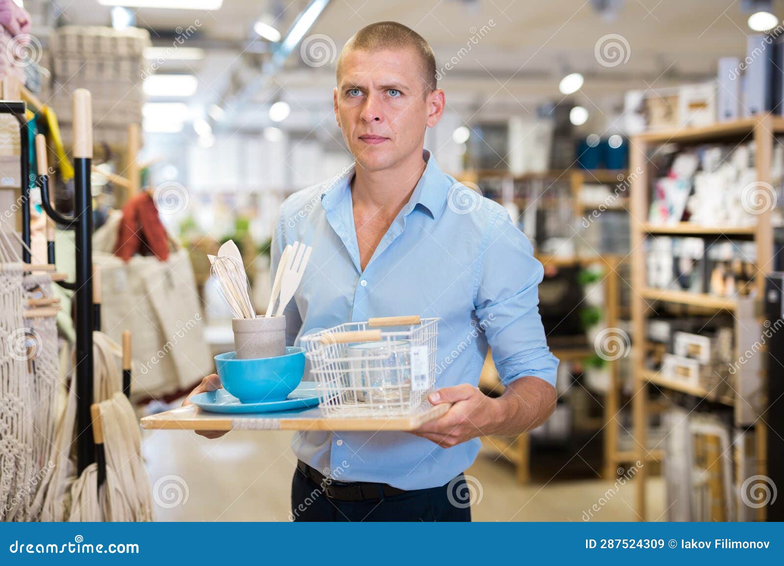 Man Walking through Store with Tray in Hands Stock Image - Image of ...
