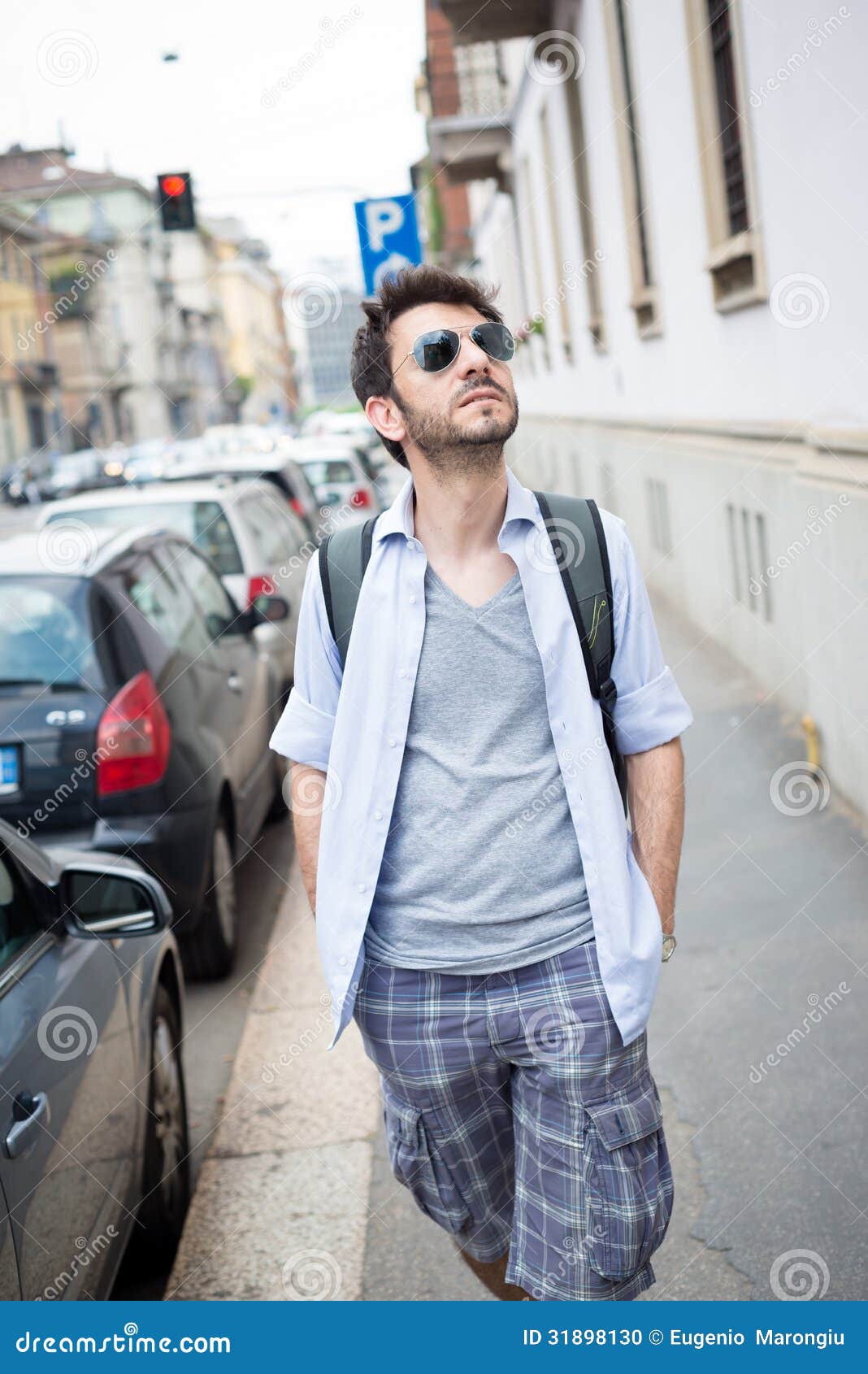 Man walking in the street stock photo. Image of sunglasses - 31898130