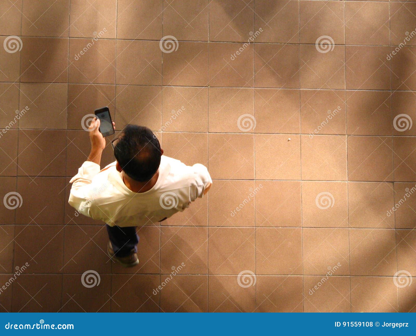 Man Walking and Texting on Mobile Phone, Aerial View. Editorial Stock ...