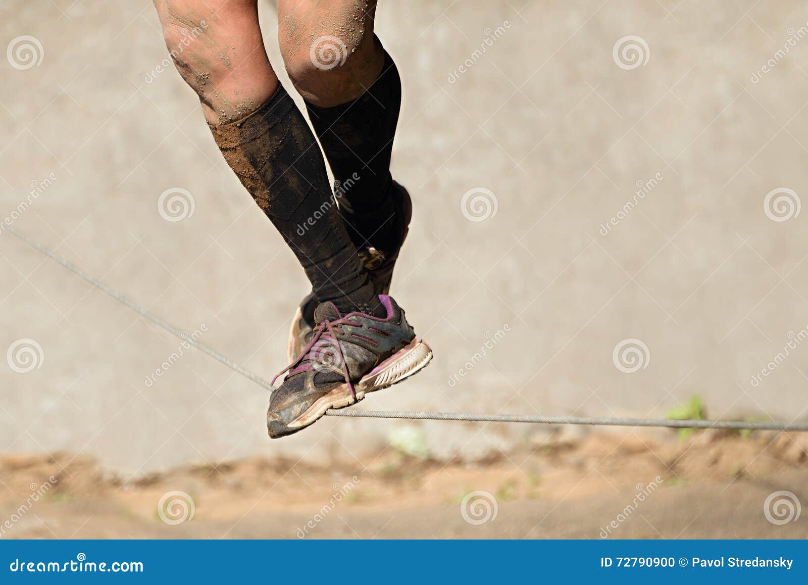 Man walking a tightrope stock photo. Image of fitness - 72790900