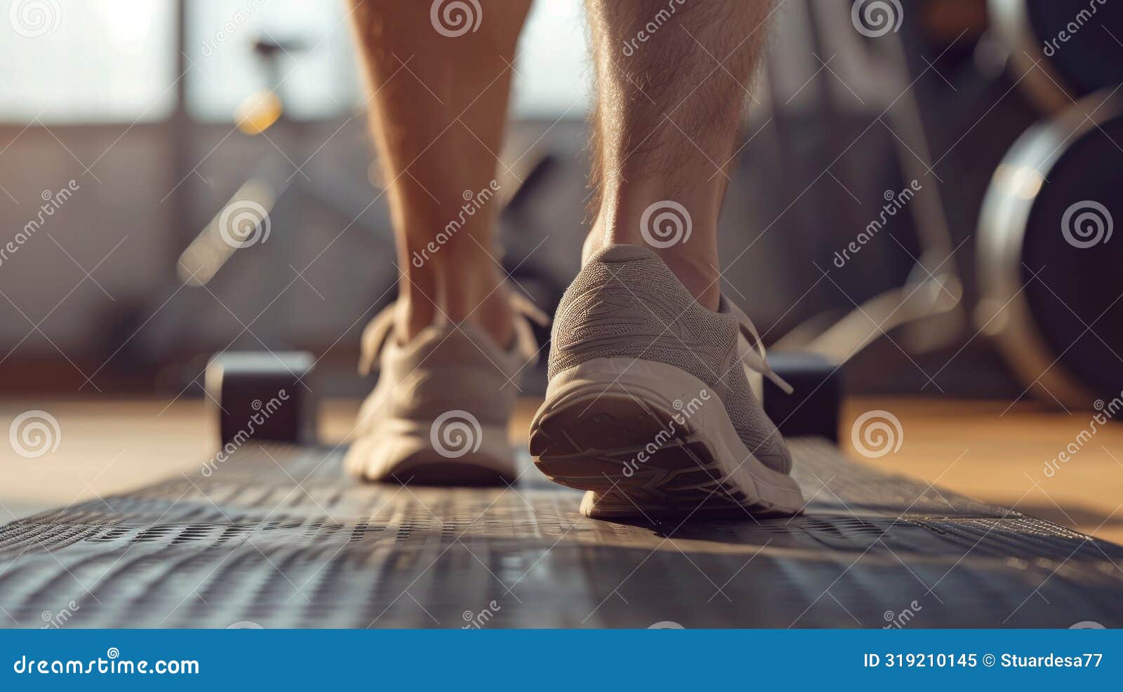 Man Walking on Treadmill stock image. Image of active - 319210145