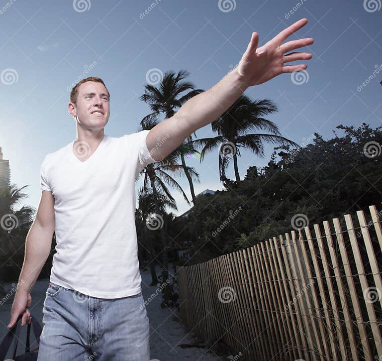Man walking and waving stock photo. Image of handsome - 13526204